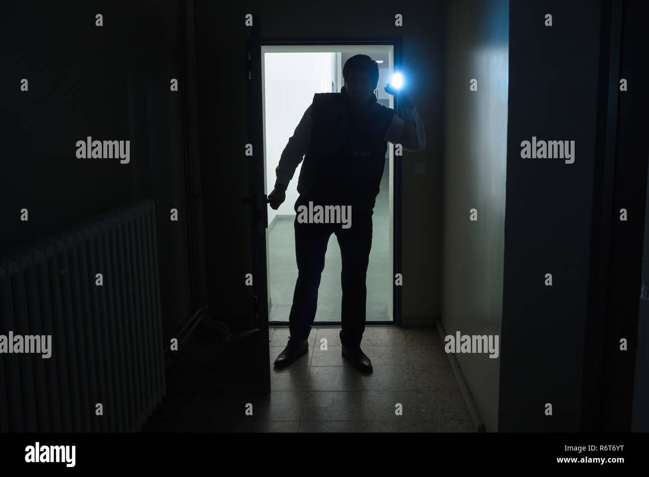 Security Guard Checking Office Stock Photo - Alamy