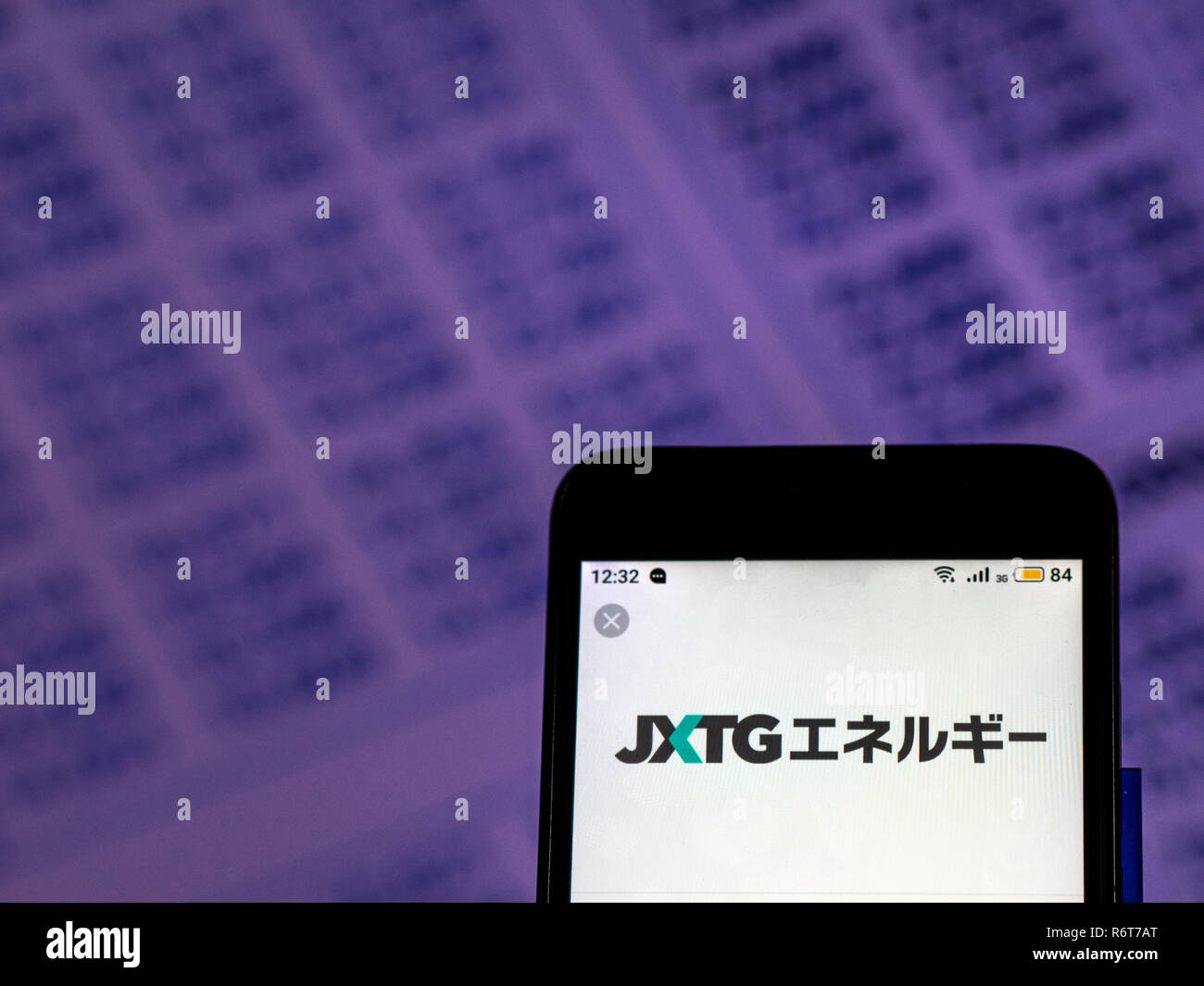JXTG Nippon Oil & Energy Corporation logo seen displayed on smart phone ...