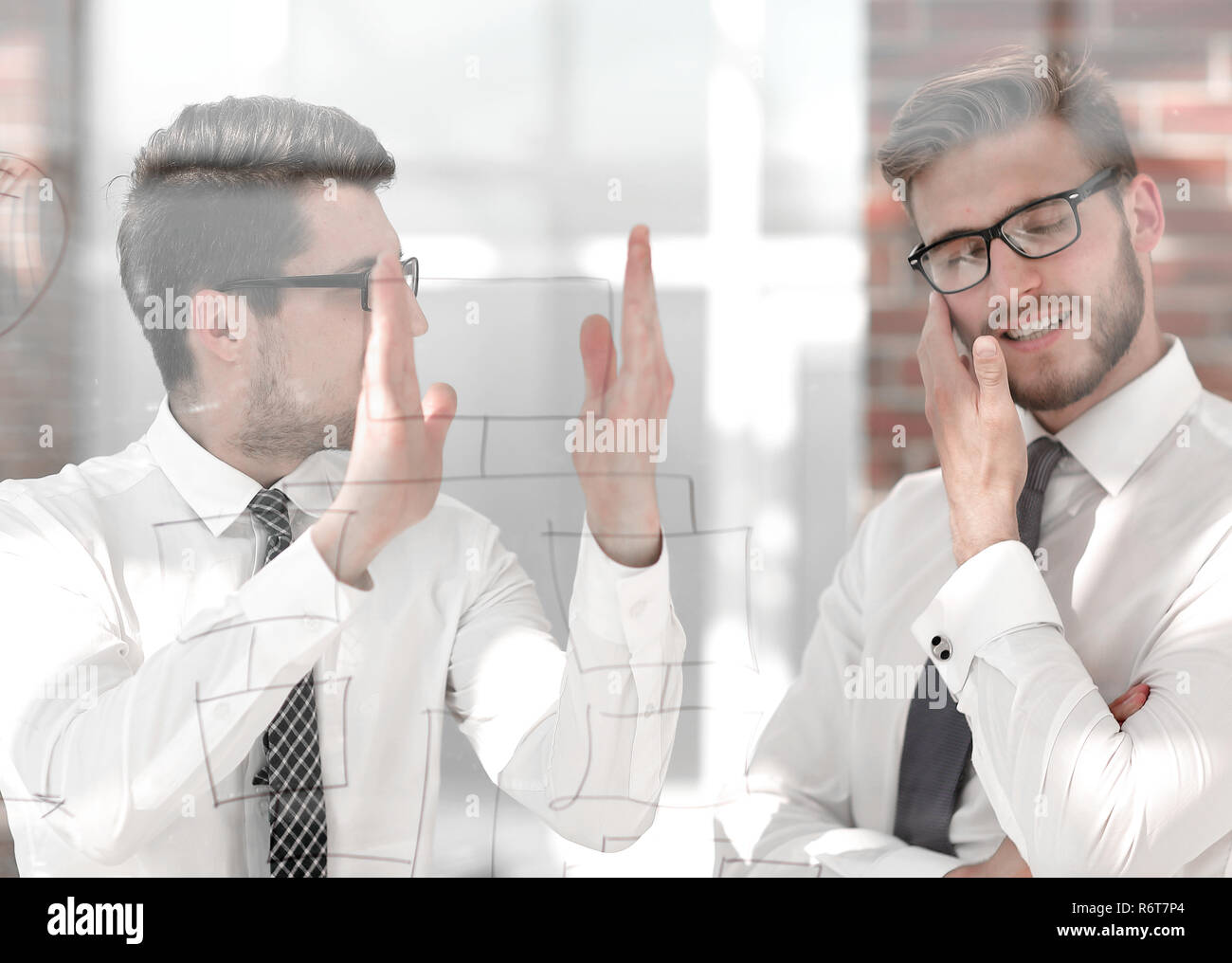close up.two employees talking standing in the office Stock Photo - Alamy