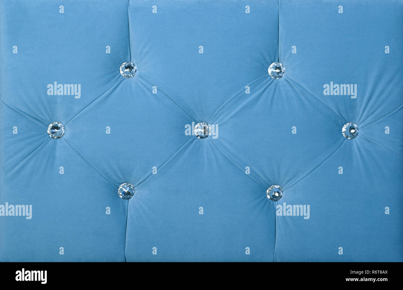 Blue soft velvet bed headboard with rhinestones Stock Photo - Alamy