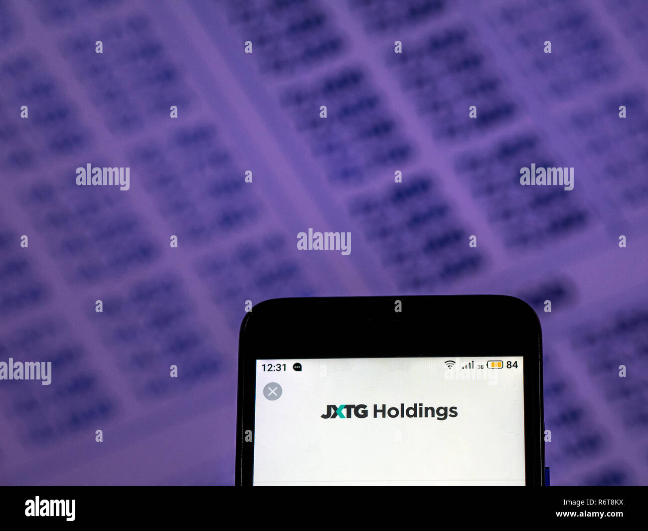 JXTG Nippon Oil & Energy Corporation logo seen displayed on smart phone ...