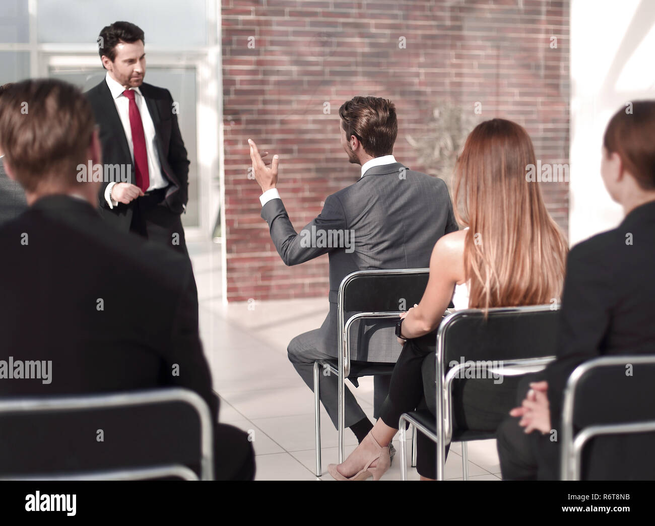 employee asks a question at a business meeting Stock Photo - Alamy