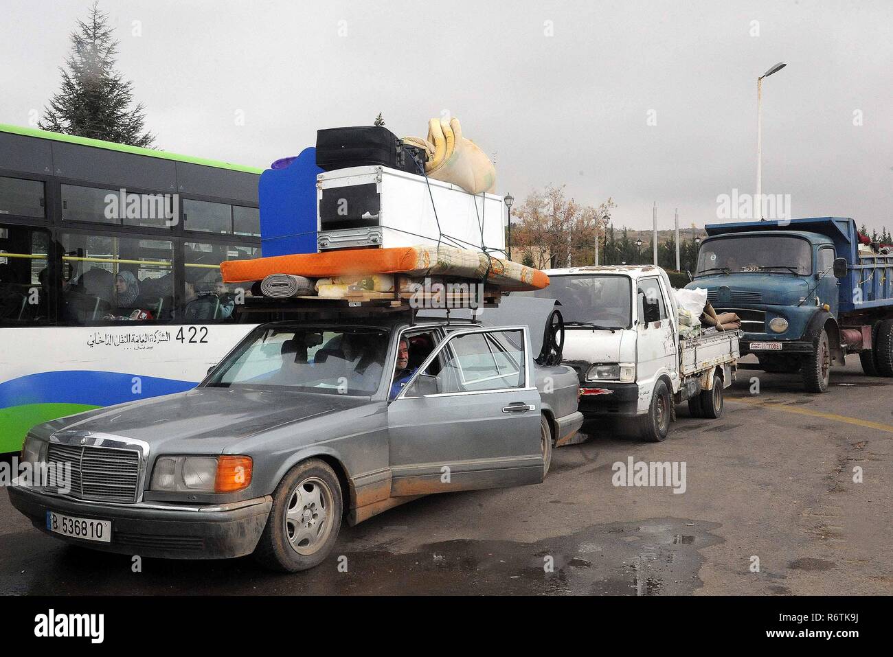 Damascus, Syria. 6th Dec, 2018. Vehicles transporting refugees are seen ...