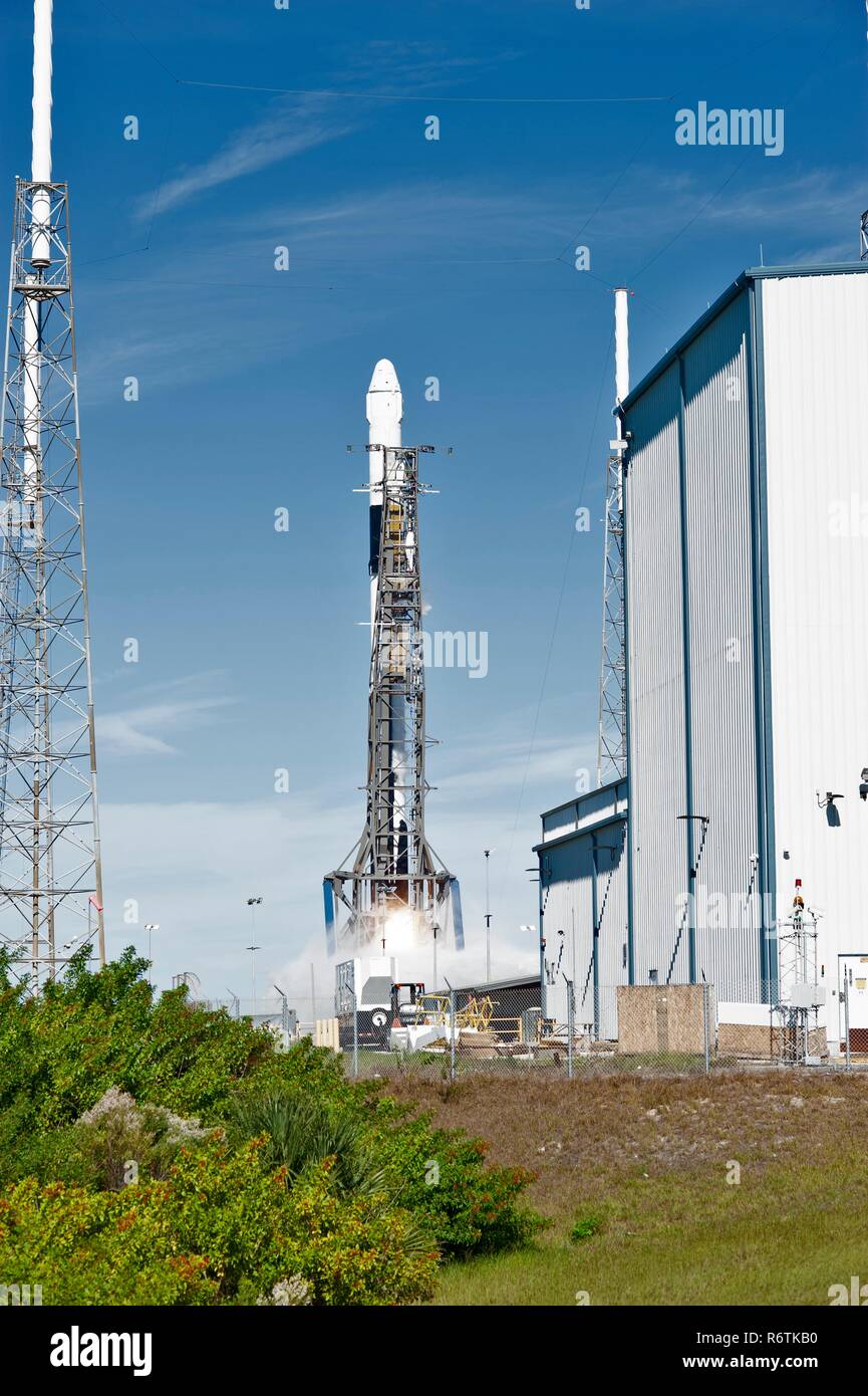 A SpaceX Falcon 9 rocket carrying the Dragon resupply spacecraft blasts ...