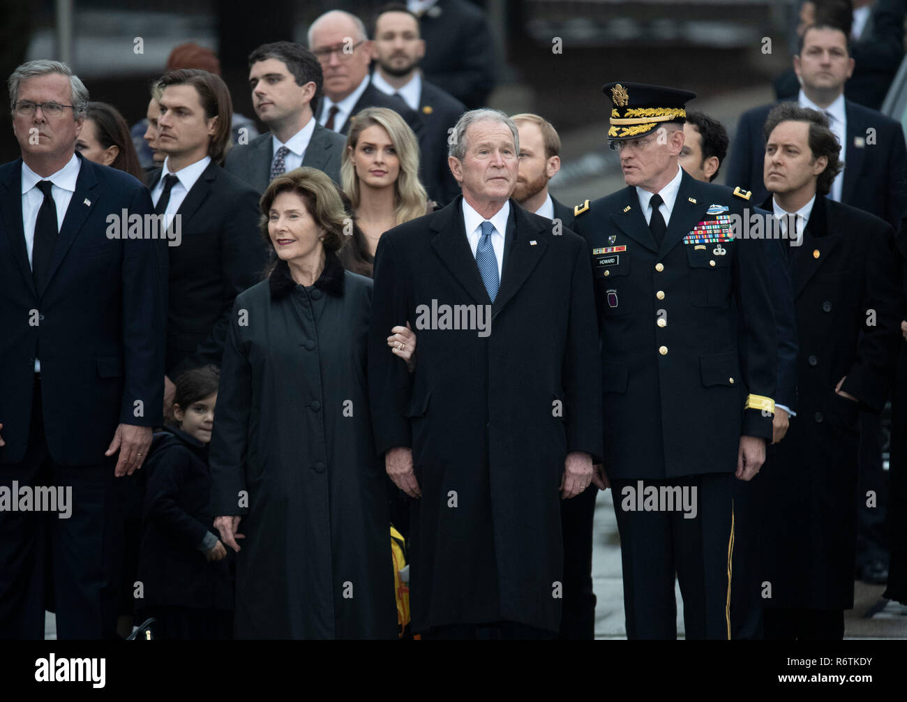 Former Pres. George W. Bush, wife Laura, and other family members stand ...
