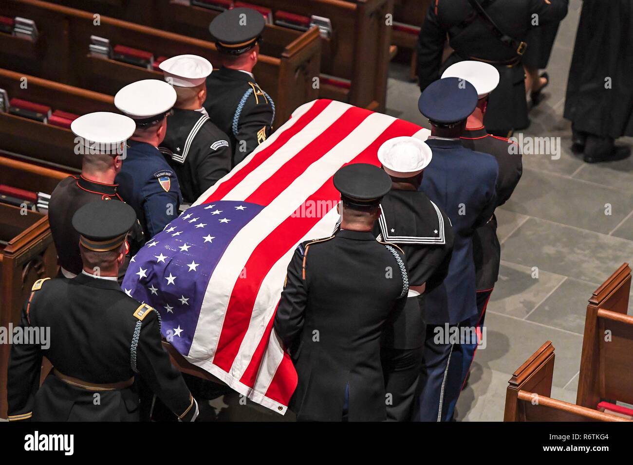 The flag draped casket of former president George H.W. Bush is carried ...