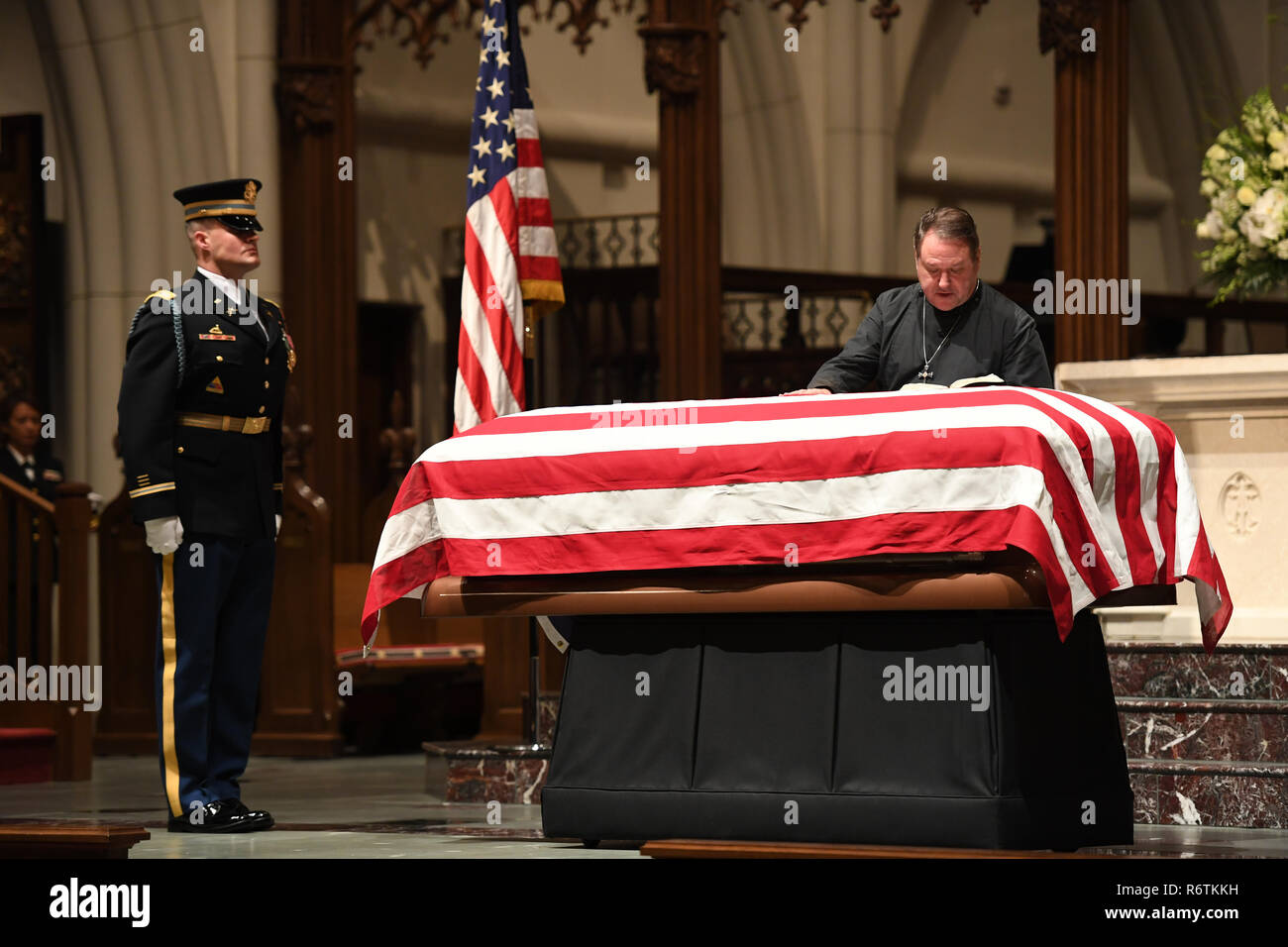 A pastor blesses the flag draped casket of former president George H.W ...