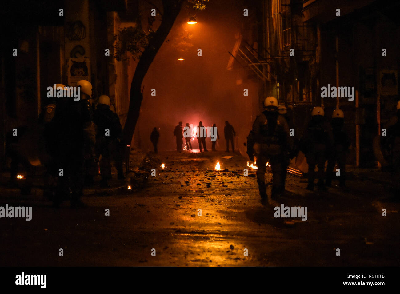 Athens, Greece. 6th Dec, 2018. A fire is seen after protesters throw ...