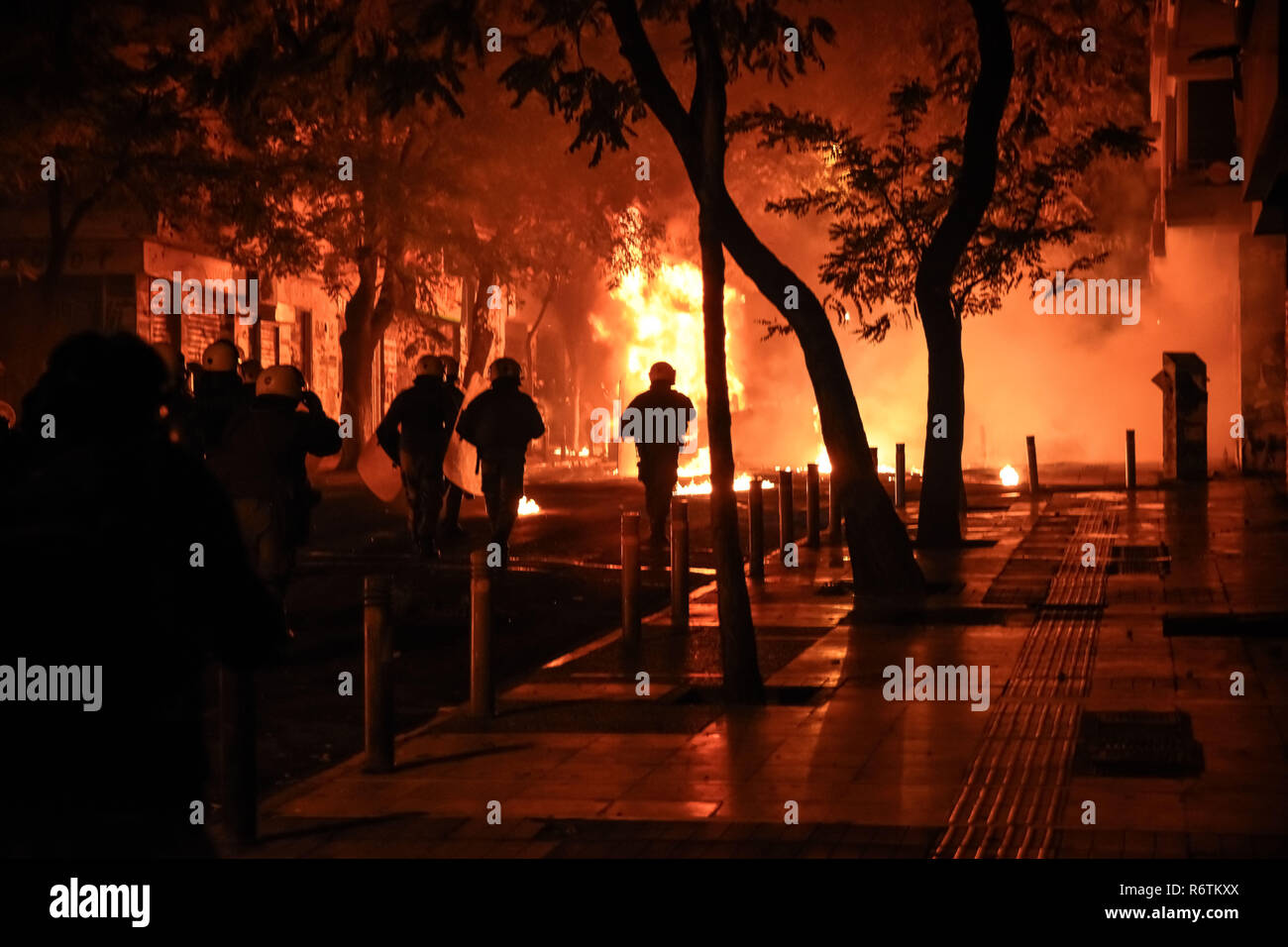 A fire is seen after protesters throw petrol bomb toward the riot ...