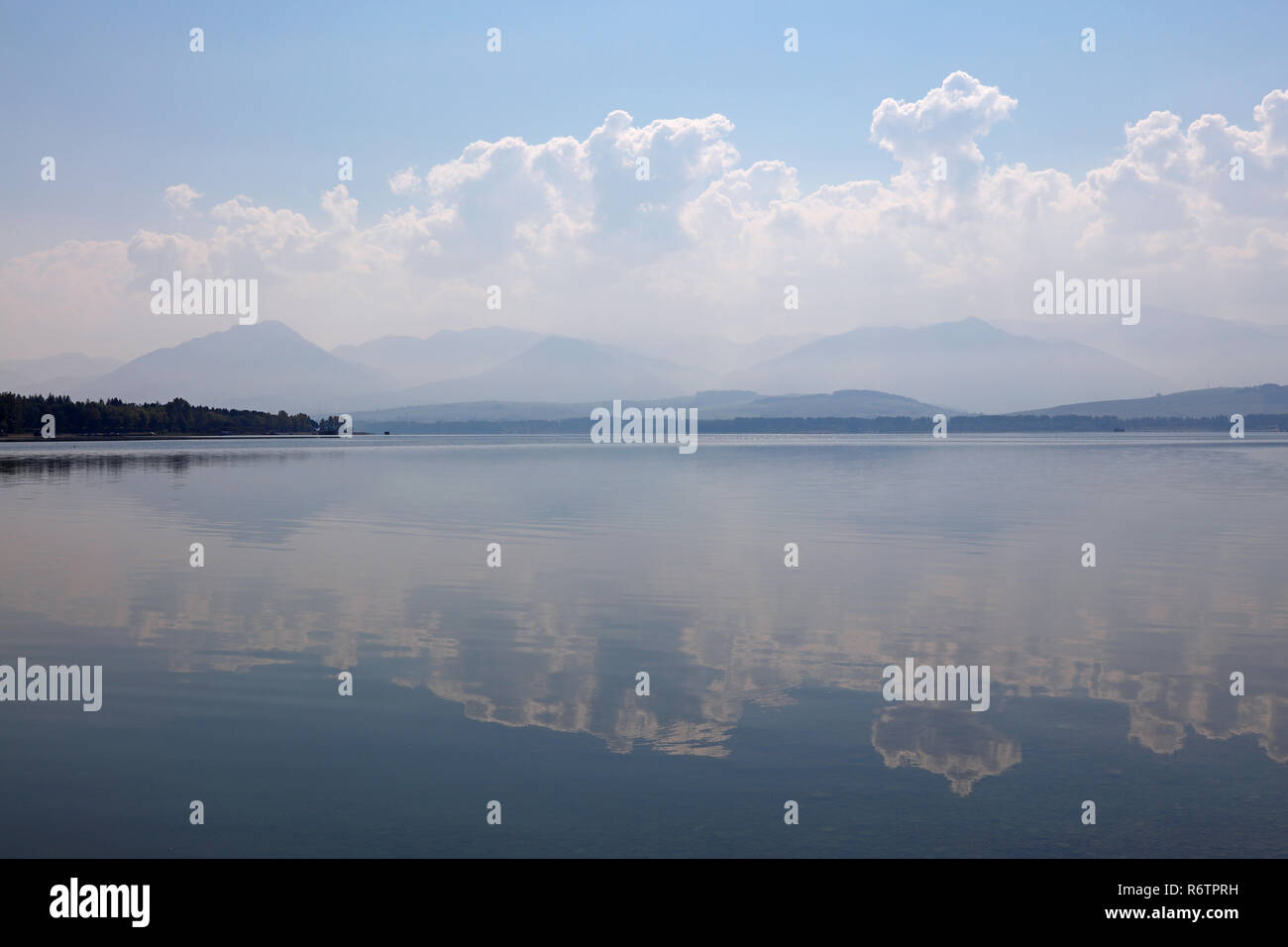 Waterscape of lake with cloudy sky reflection Stock Photo - Alamy