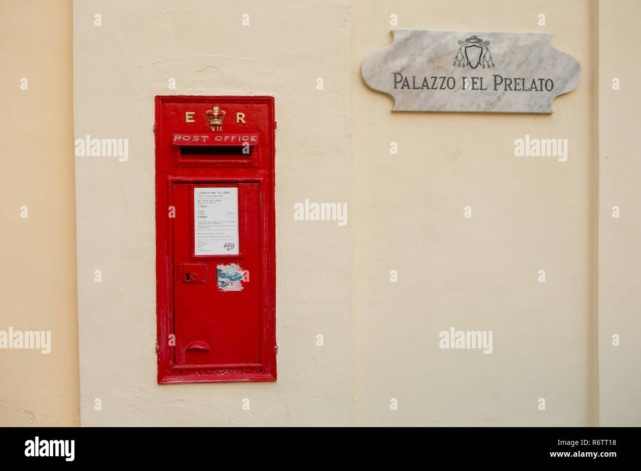 A British red postbox which stands in the corner of the main square in ...