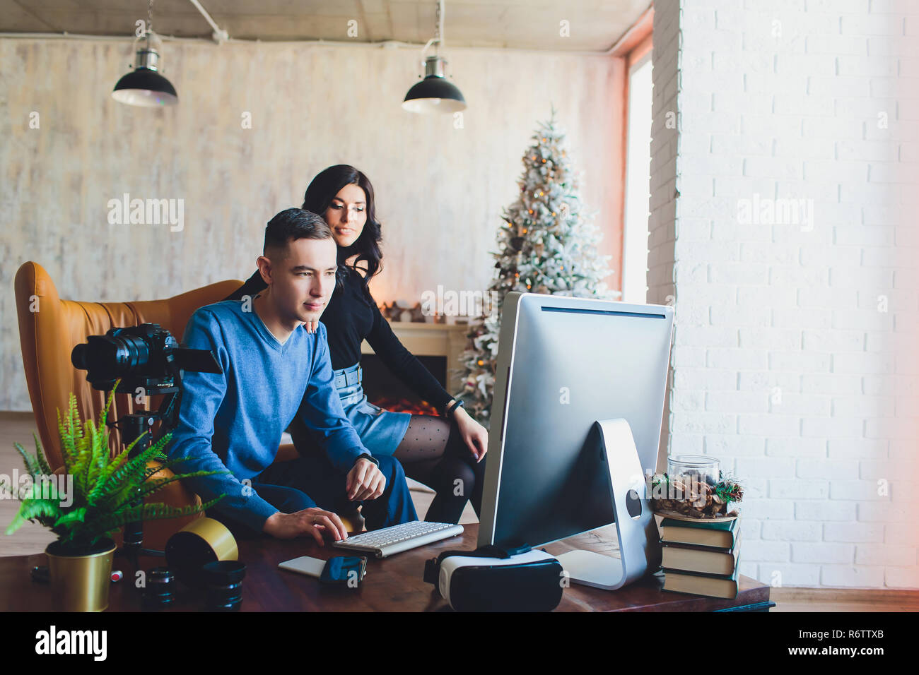 stabilizer camera. computer monitor. Young freelancer man editing video ...