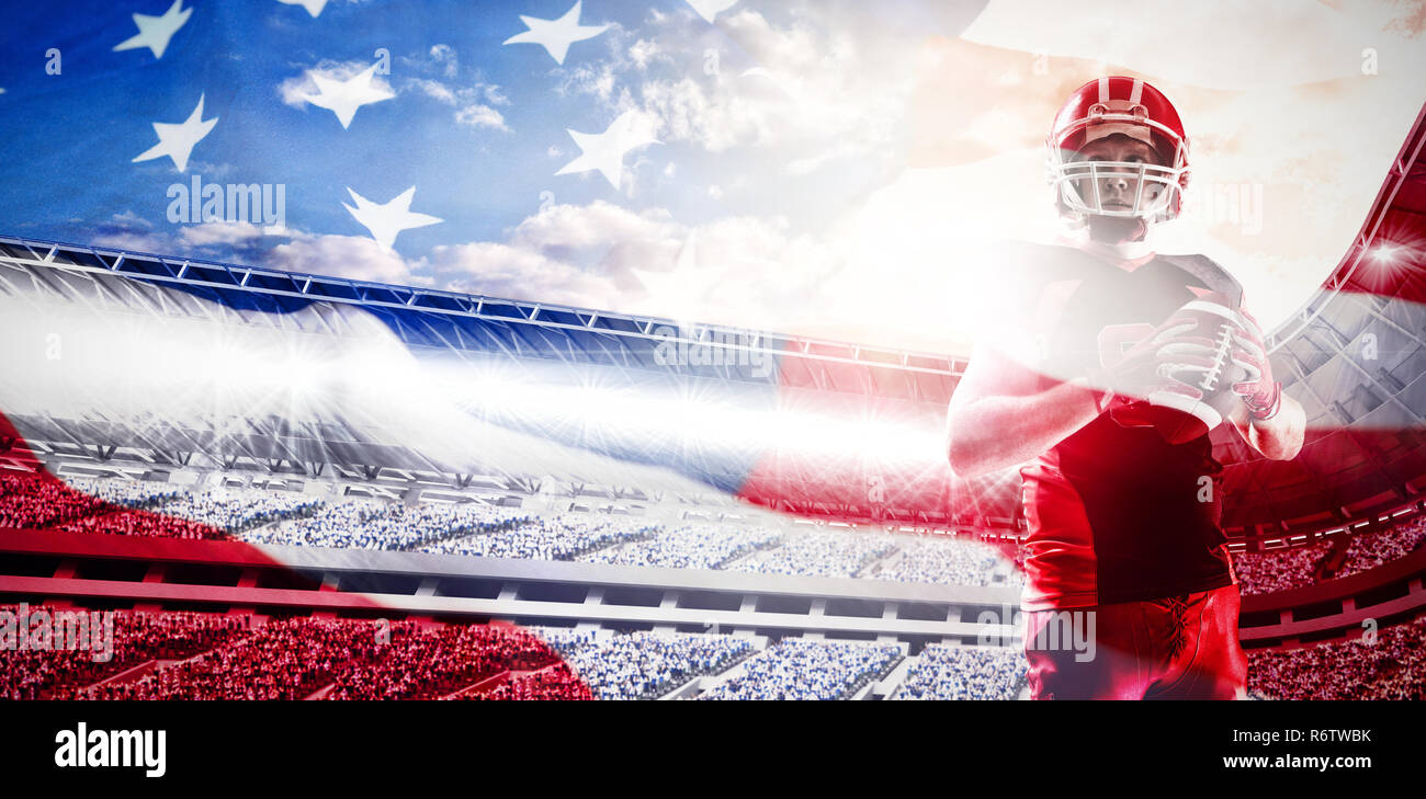 American football player standing with helmet preparing to throw ball ...