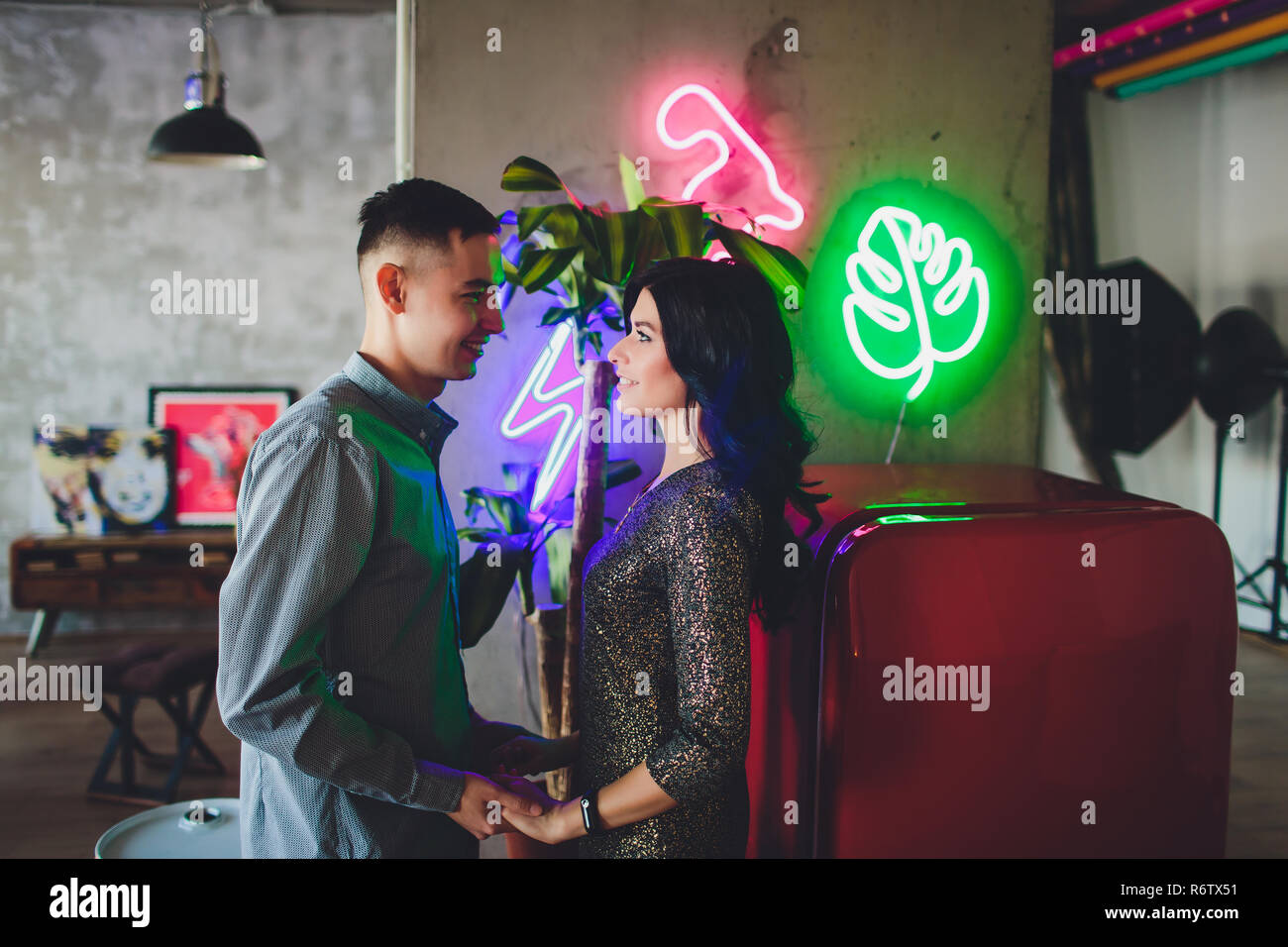 Love story of a lovely couple in loft interior Stock Photo - Alamy