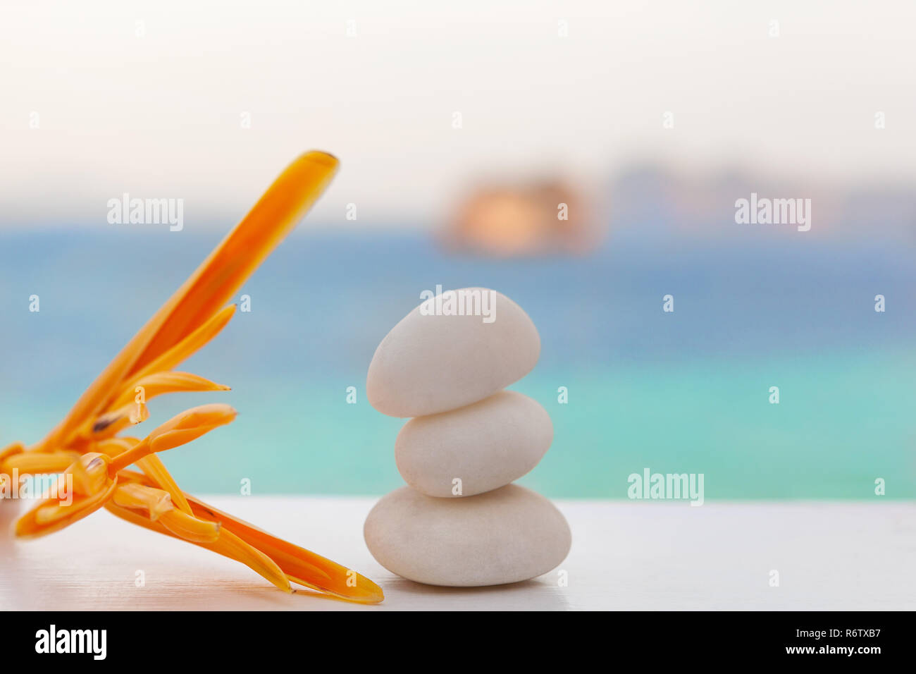 Rock cairn on tropical beach Stock Photo - Alamy