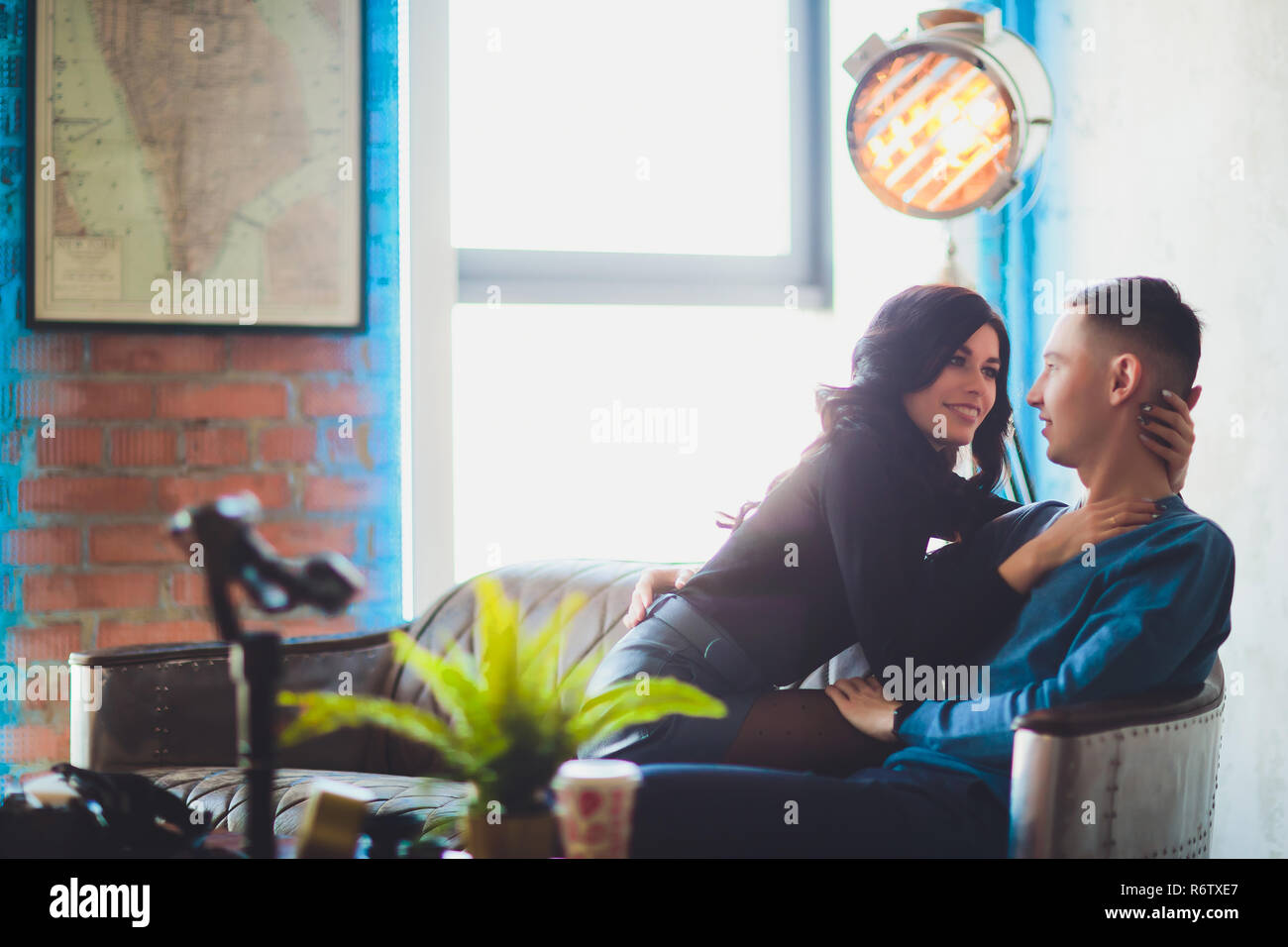 Love story of a lovely couple in loft interior Stock Photo - Alamy