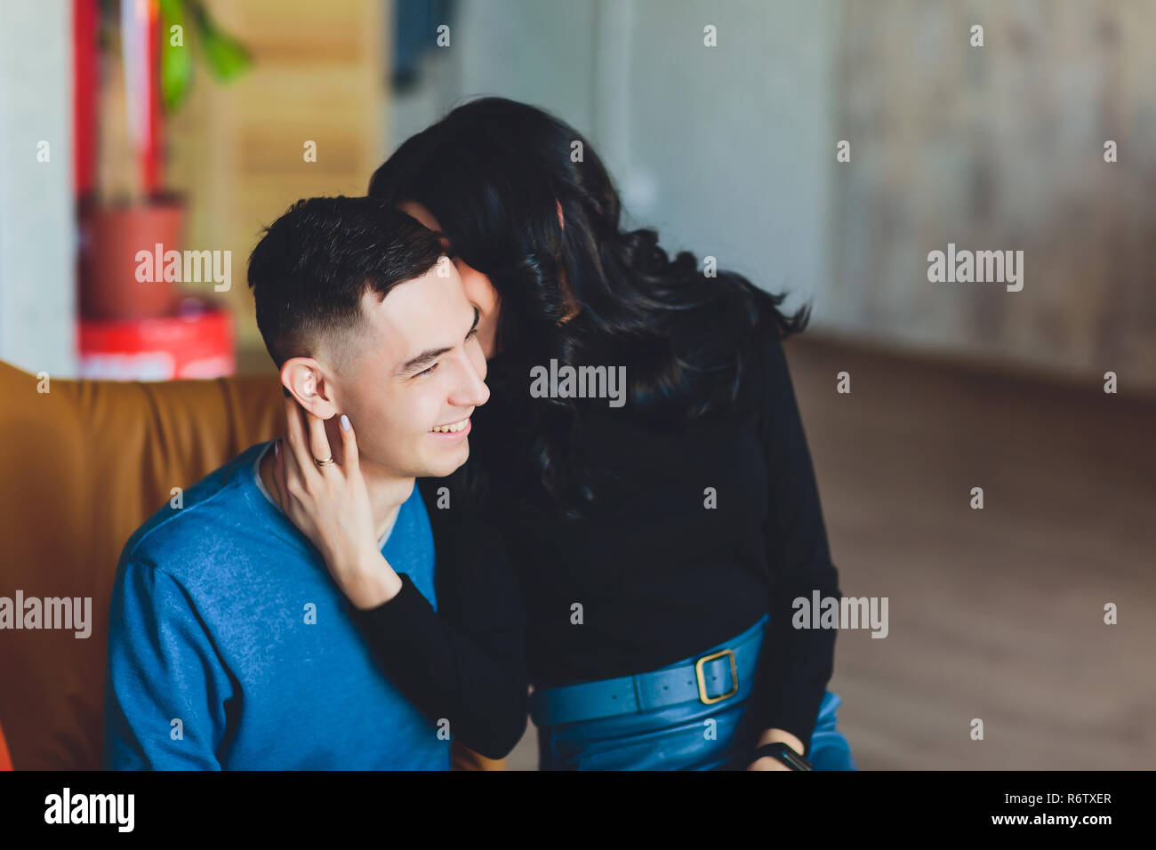 Love story of a lovely couple in loft interior Stock Photo - Alamy