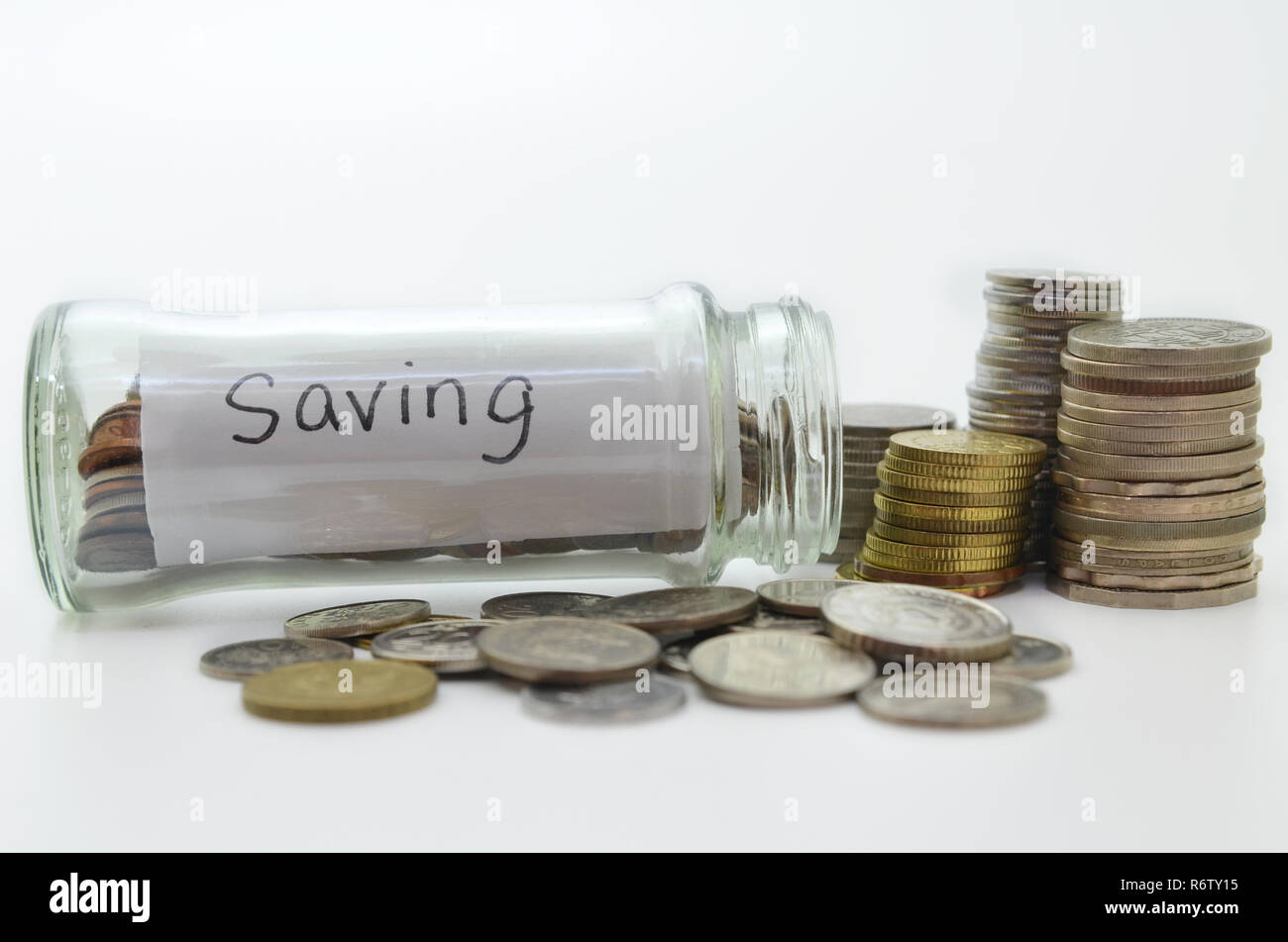Clear glass jar for tips with money Stock Photo - Alamy