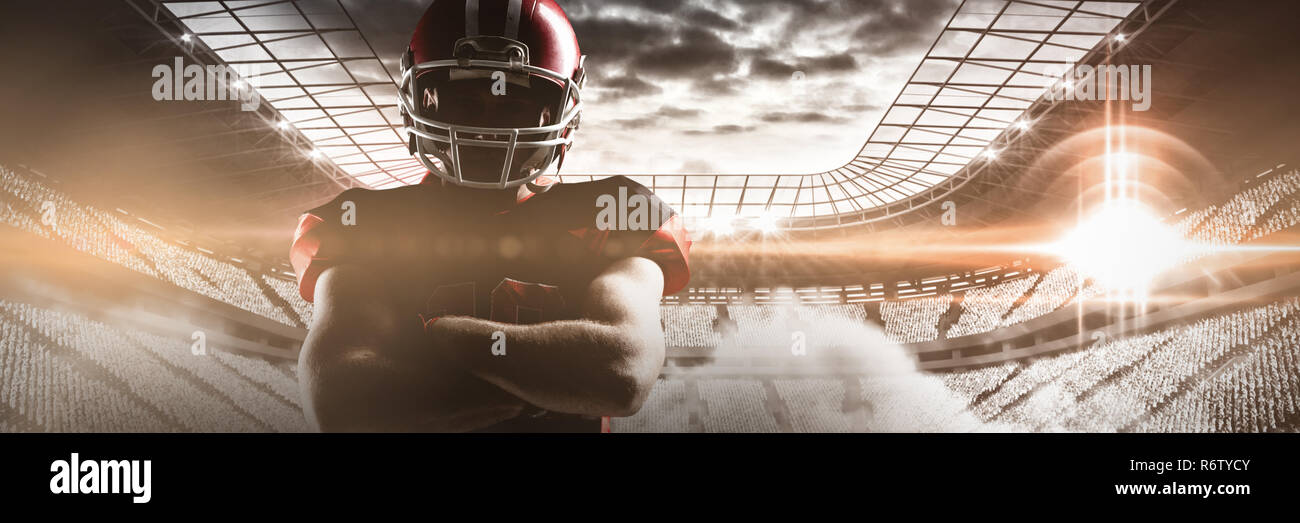 Young American football player standing with arms crossed Stock Photo ...