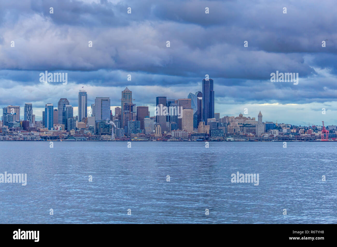 A view of the Seattle skyline with dark clouds overhead Stock Photo - Alamy