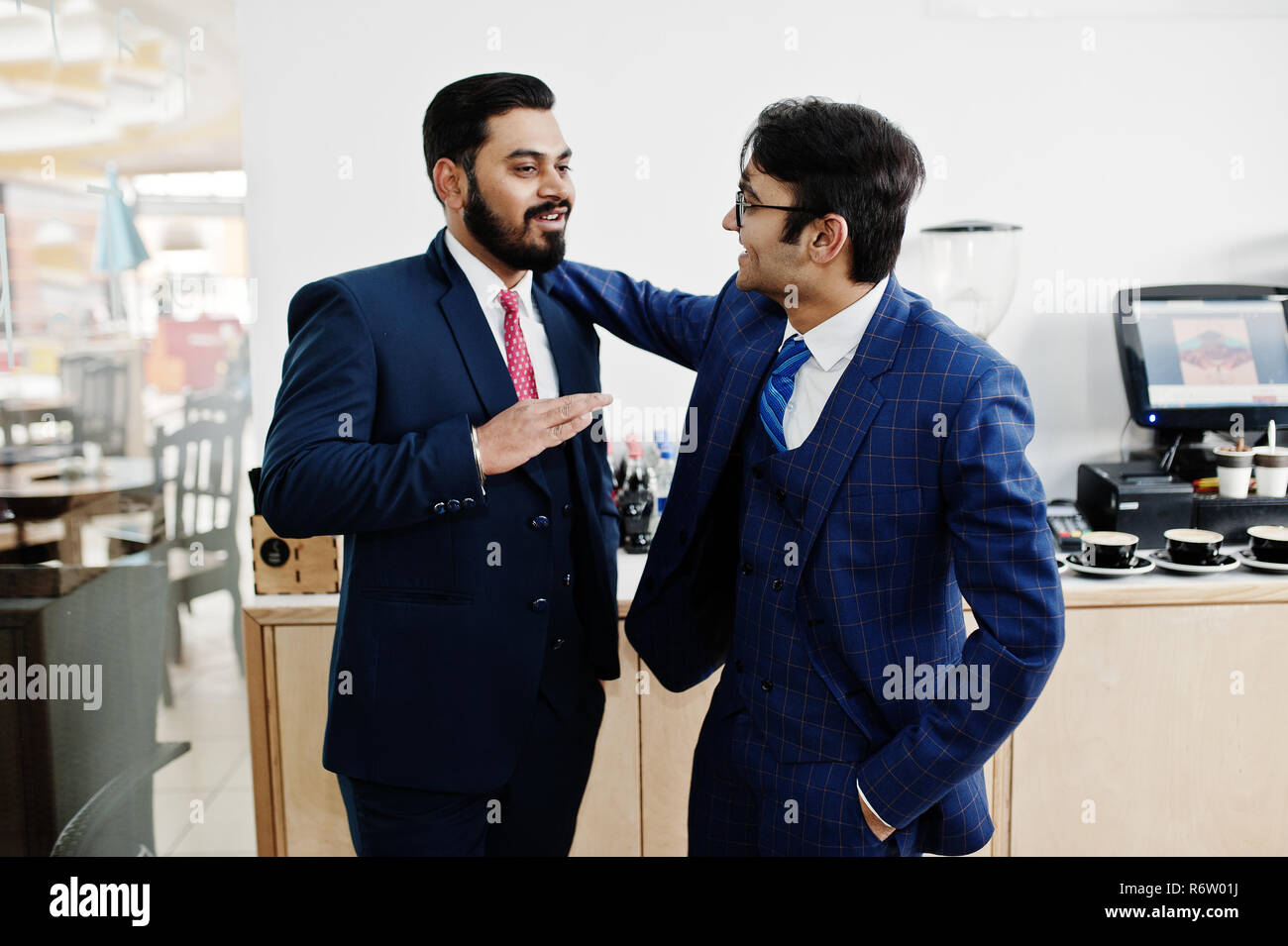 Two people in suits discuss hi-res stock photography and images - Alamy