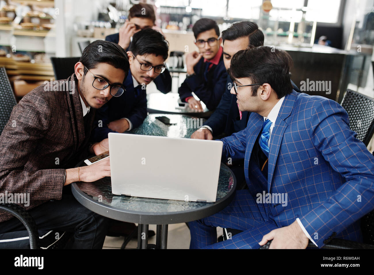 Group of six indian business man in suits sitting at office on cafe and ...