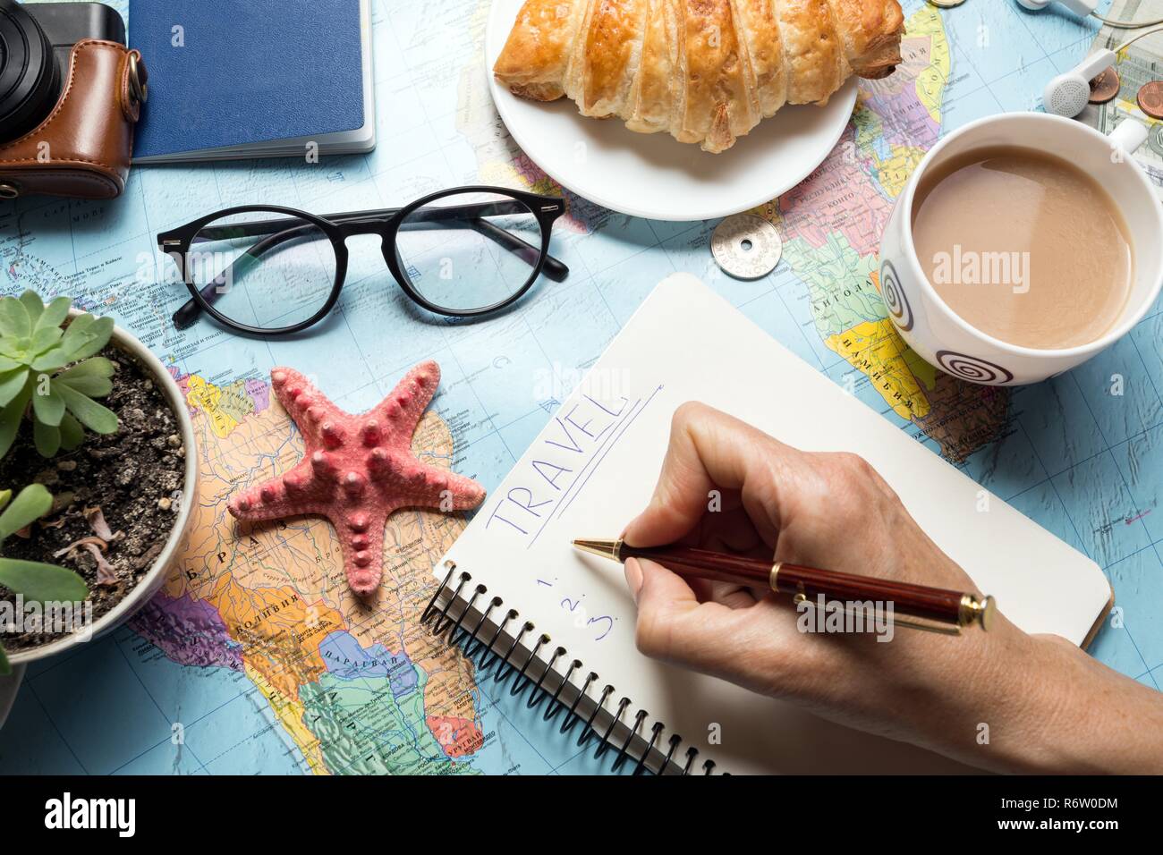 Plan of trip. background - what to take for a trip. Women's hands and ...