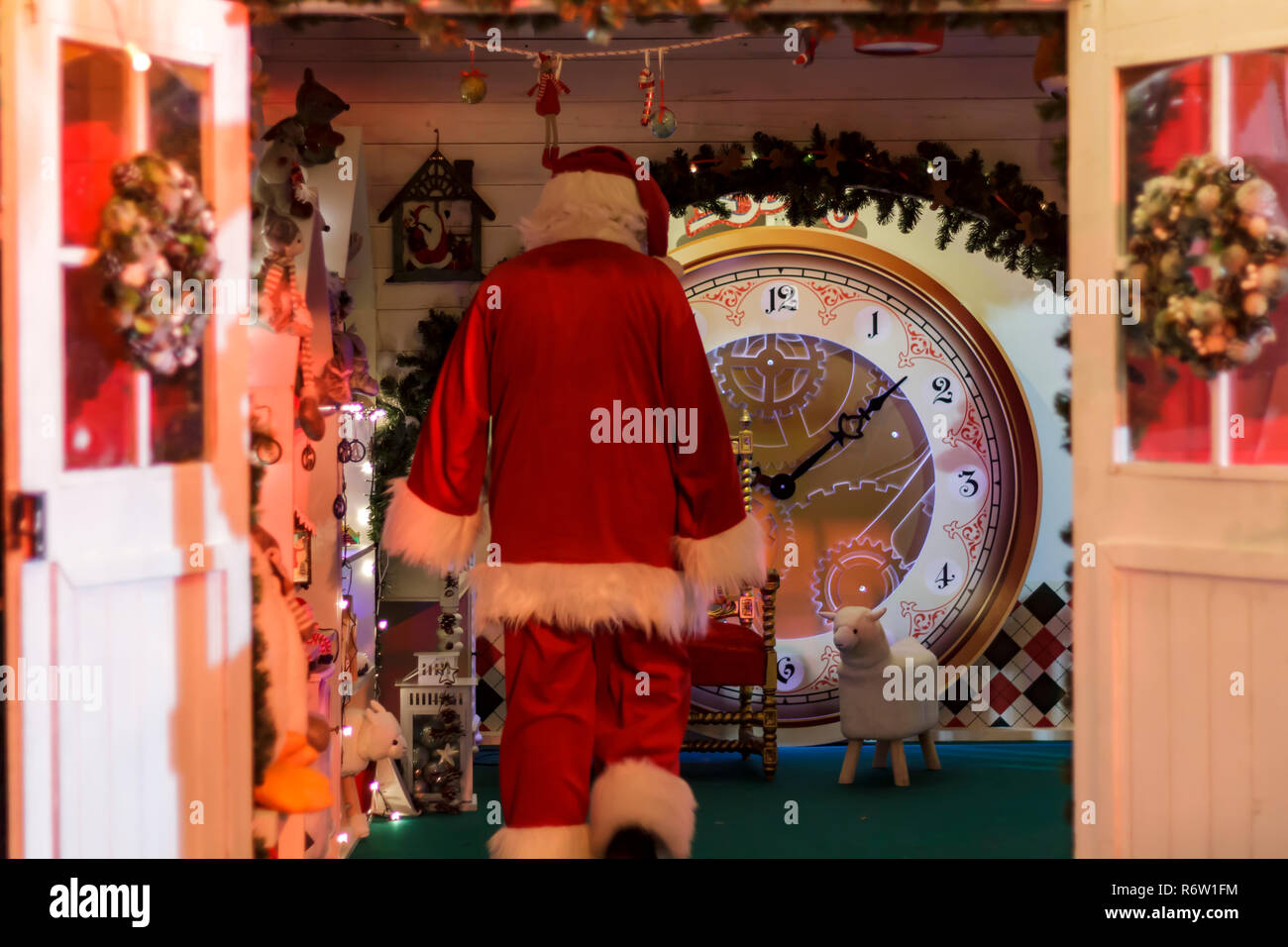 Santa claus entering home Stock Photo - Alamy