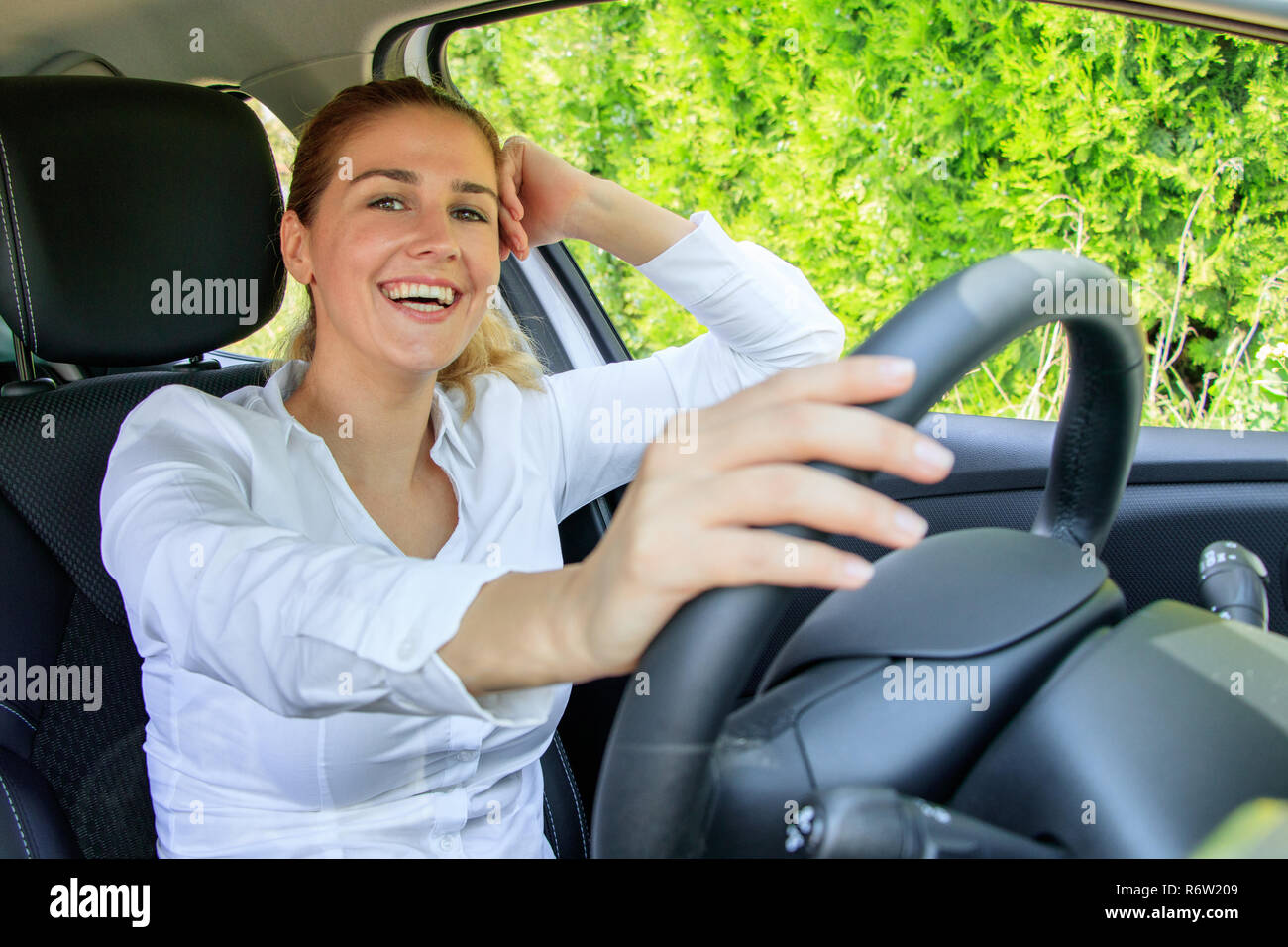 Woman is driving her car Stock Photo - Alamy