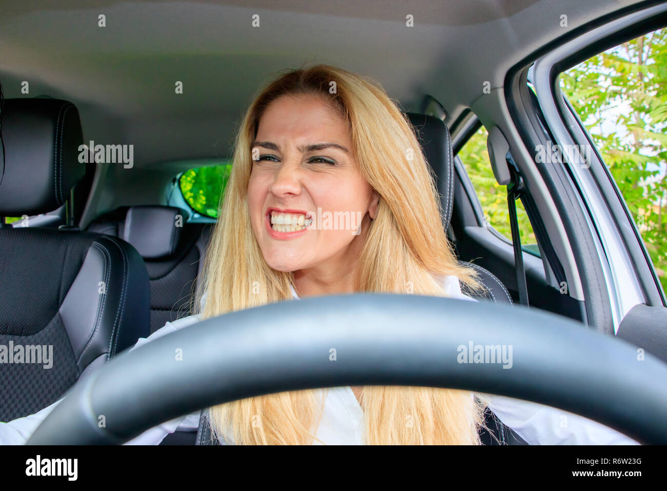 Woman is driving her car Stock Photo - Alamy