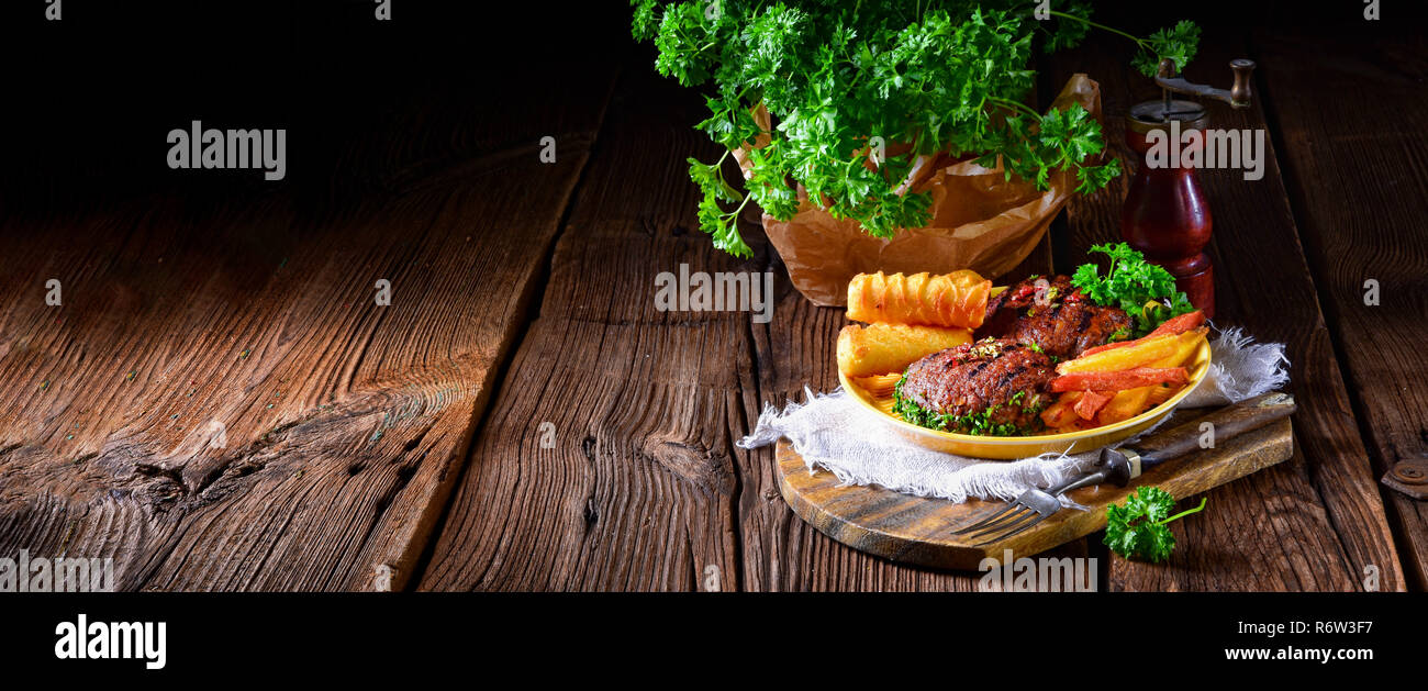 grilled bullets with croquettes and vegetables Stock Photo - Alamy