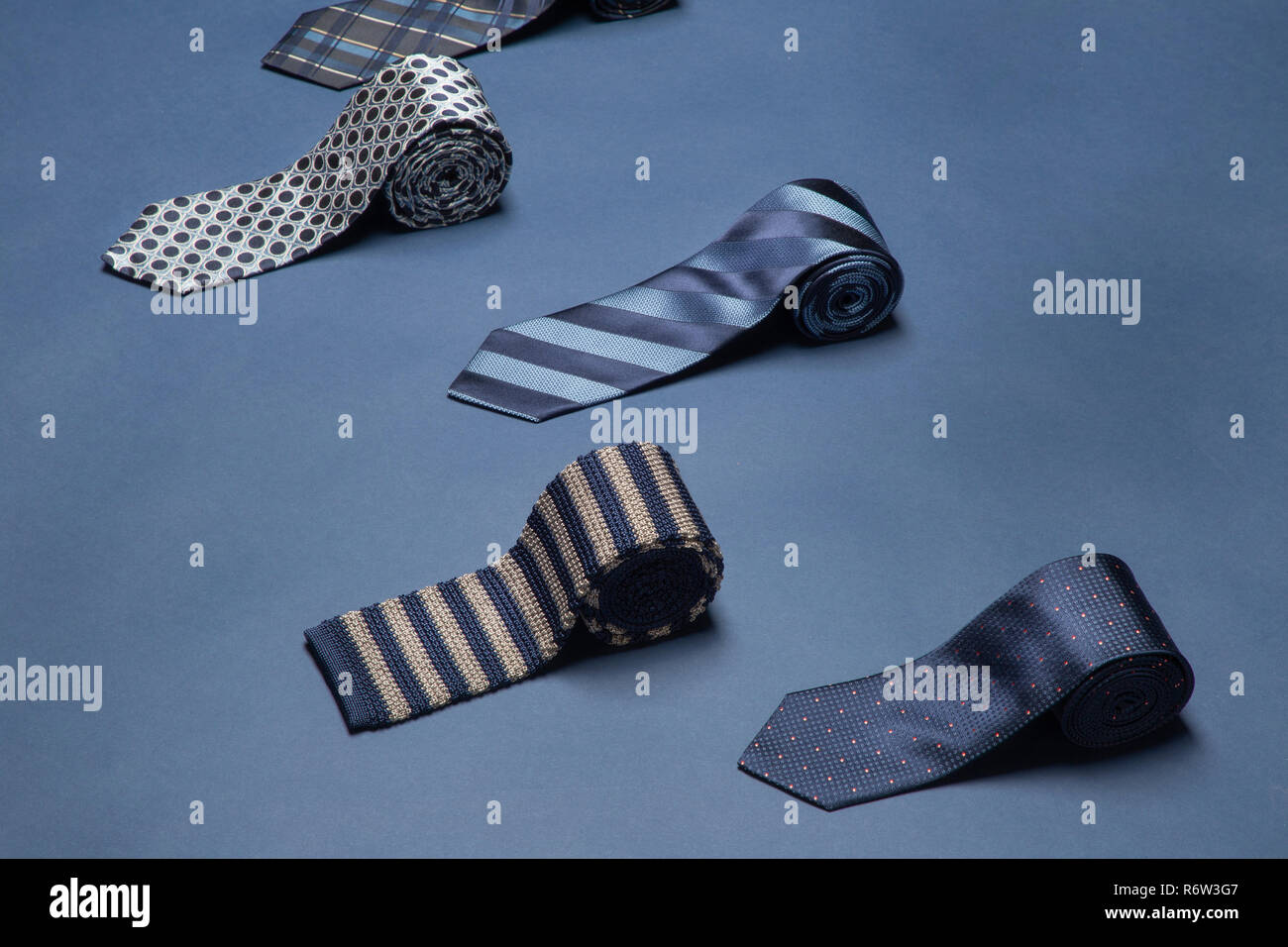 creative tie with blue background Stock Photo - Alamy