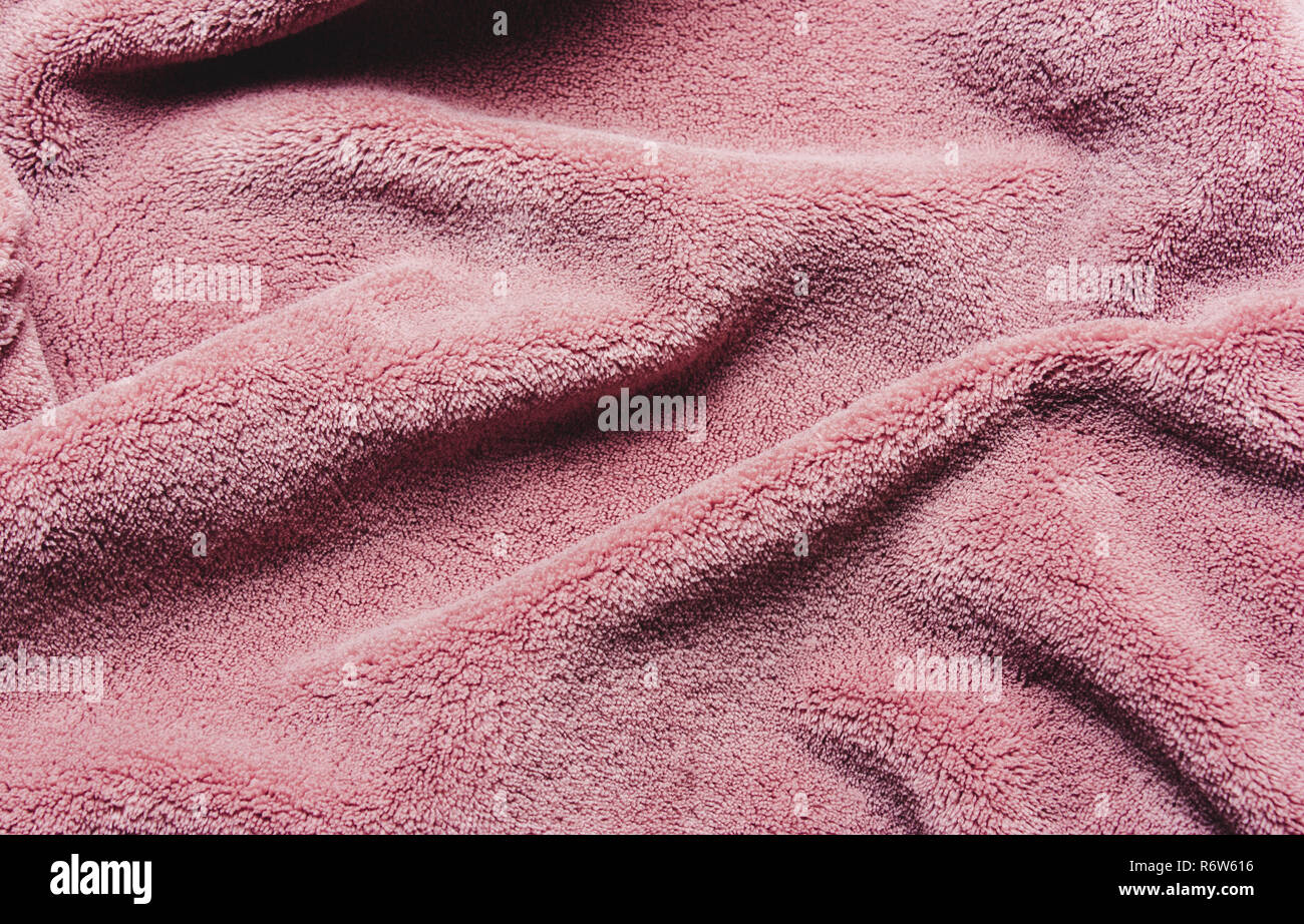 Pink soft fleece texture. The surface of a teddy crumpled microfiber ...