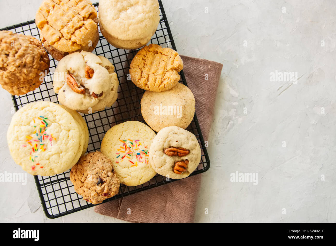 Set of festive cookies on a wire rack. Peanut butter, pecan, oatmeal ...