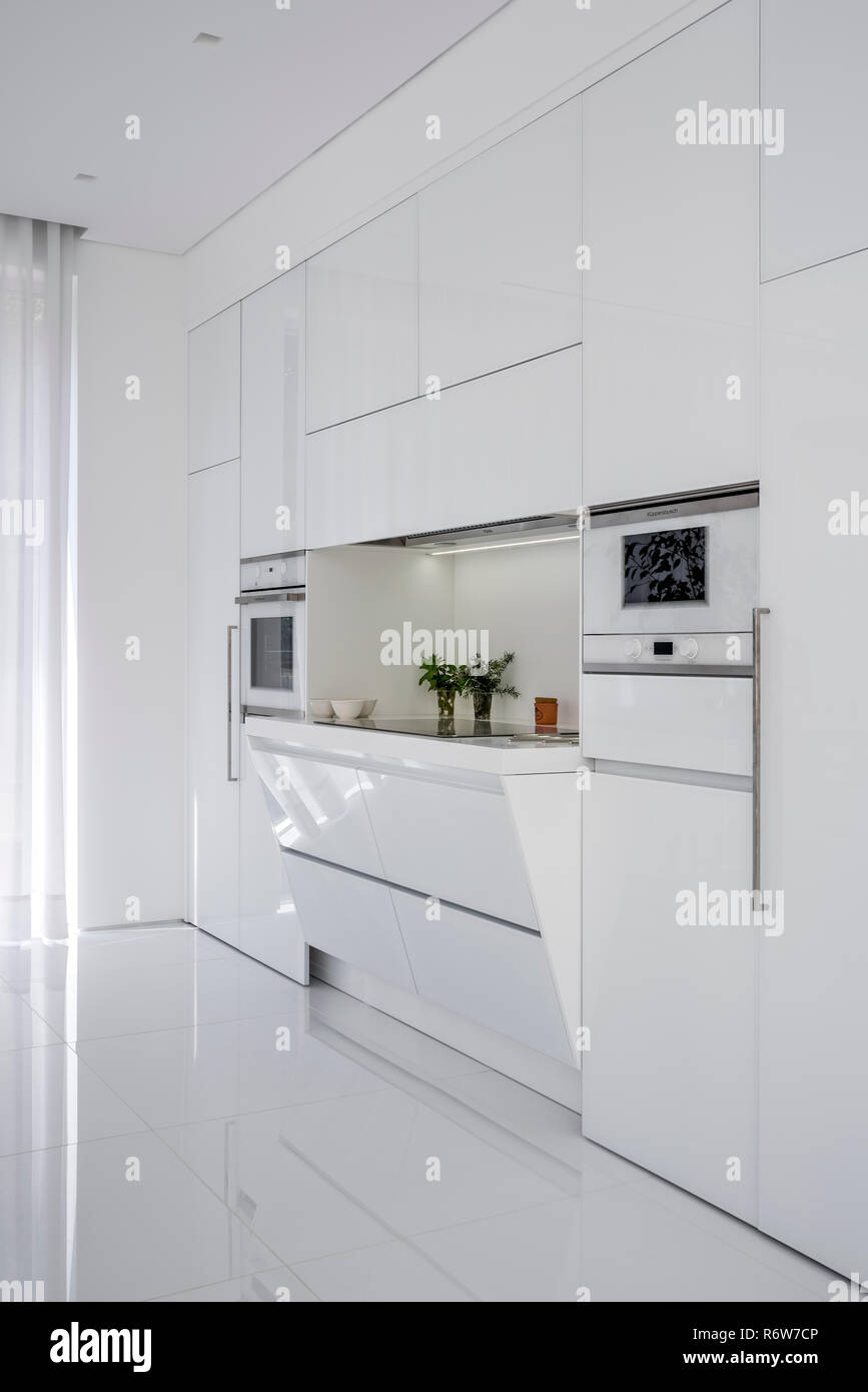 Recessed induction hob in minimalist kitchen of new build villa, Quinta ...
