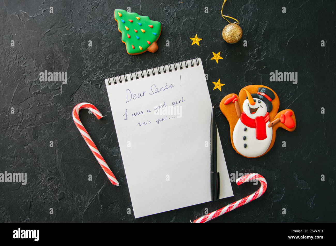 Festive Christmas background, white page of notepad with inscription ...