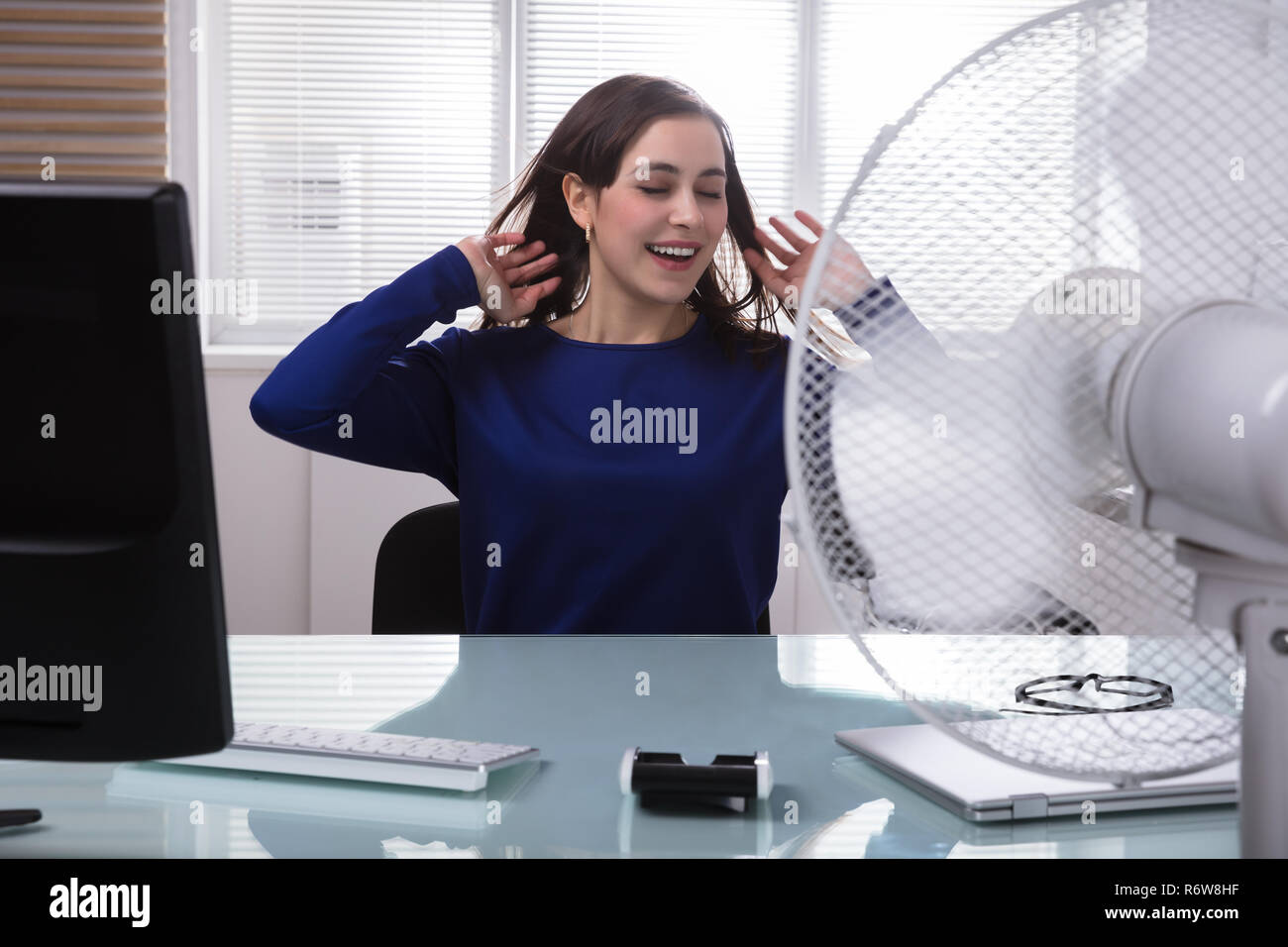 Too hot woman sweating fan hi-res stock photography and images - Alamy