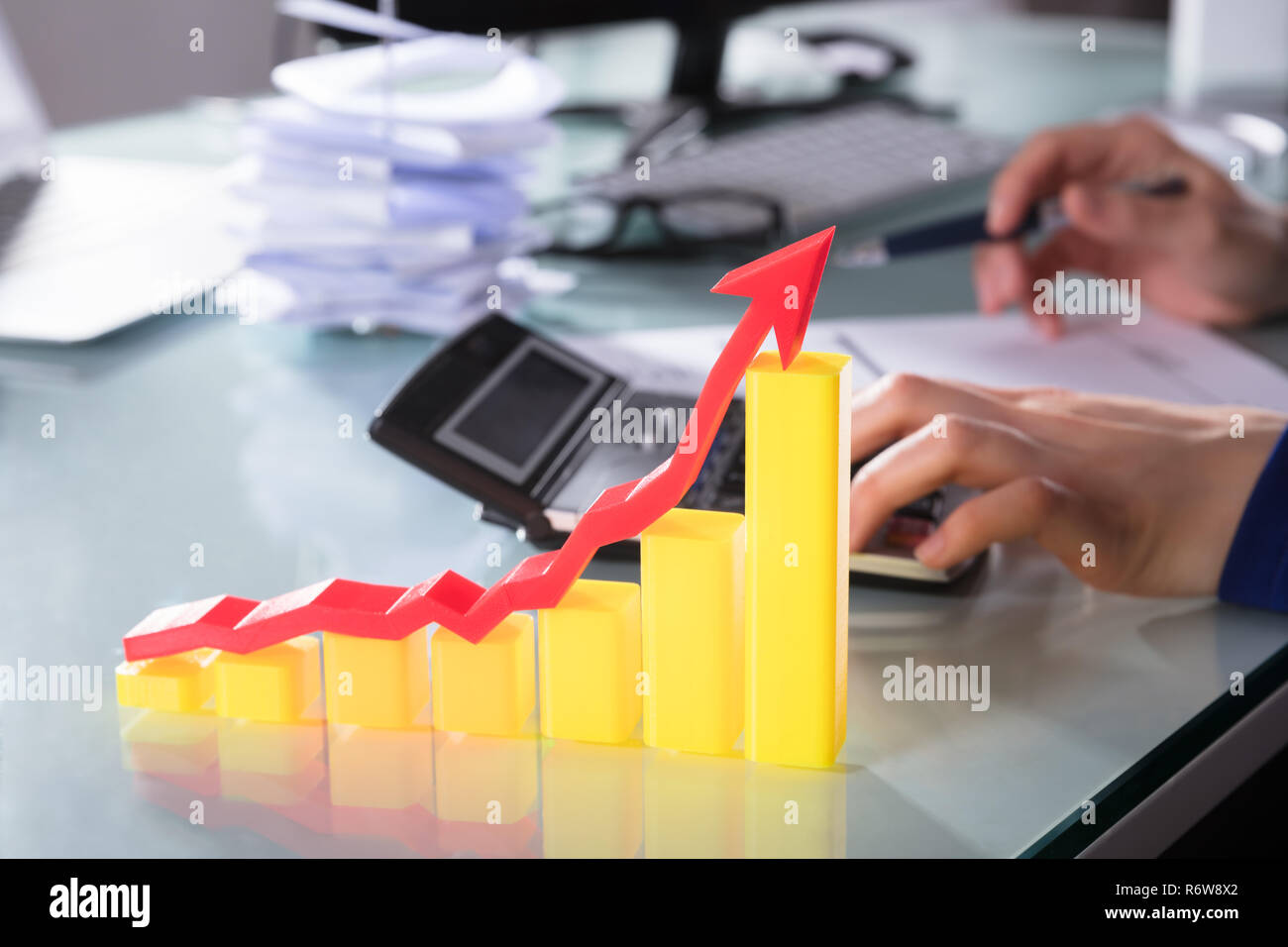Red Arrow Over Increasing Graph Stock Photo - Alamy