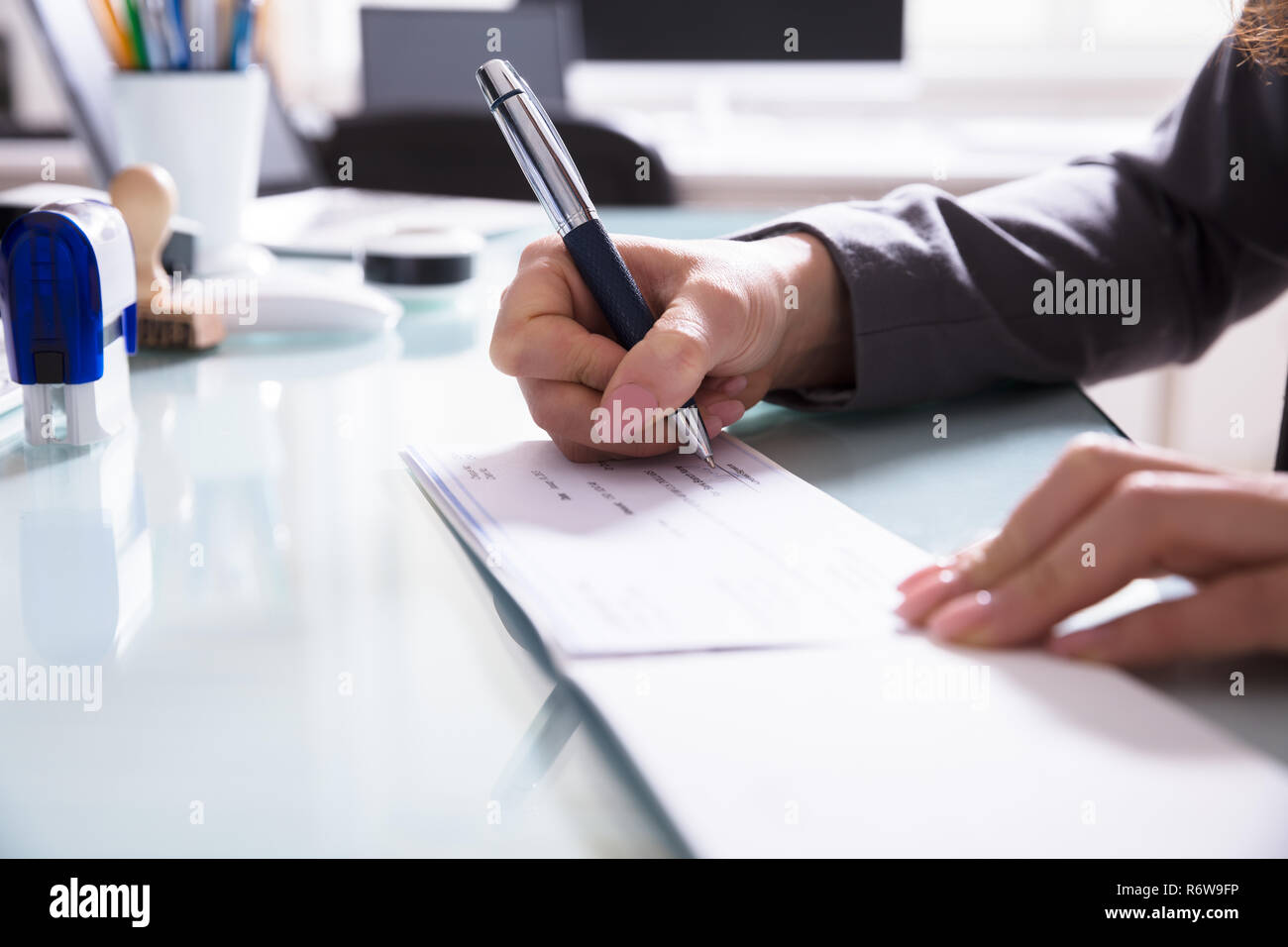 Paying in cheque hi-res stock photography and images - Alamy