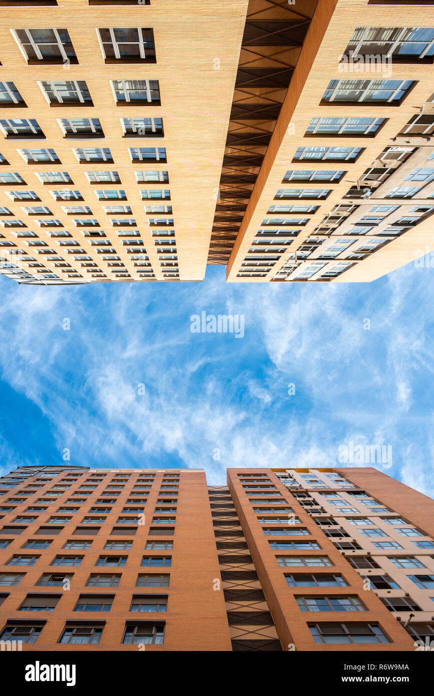 Vertical buildings of houses with blue sky background photographed from ...