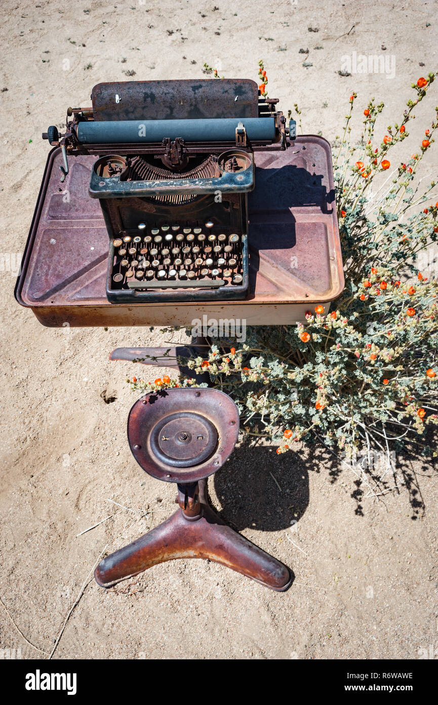 Old rusty typewriter outdoors in a desert landscape Stock Photo - Alamy