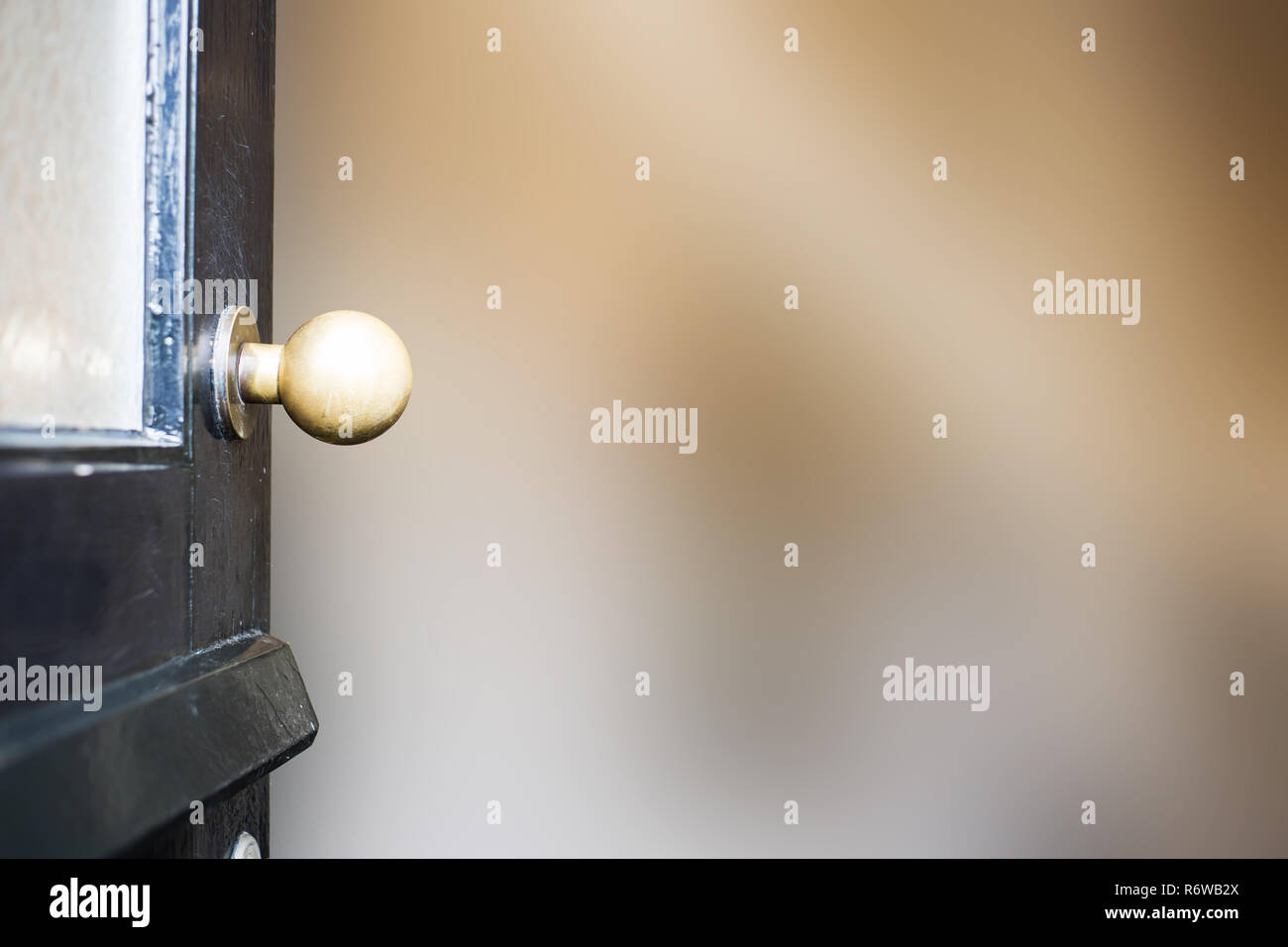 Open front door close-up to new home blurred background Stock Photo - Alamy