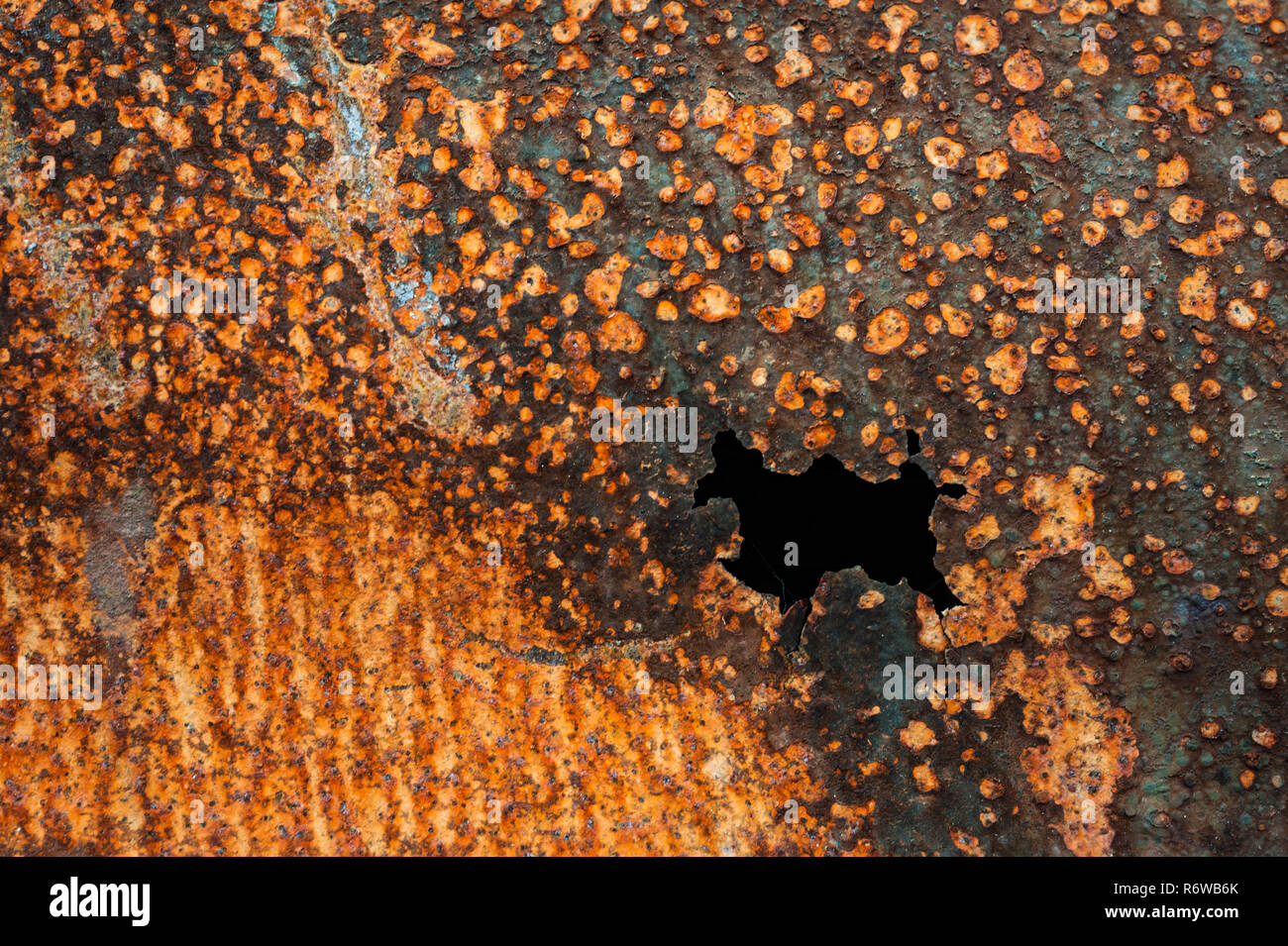 cracked hole rusty texture metal background Stock Photo - Alamy