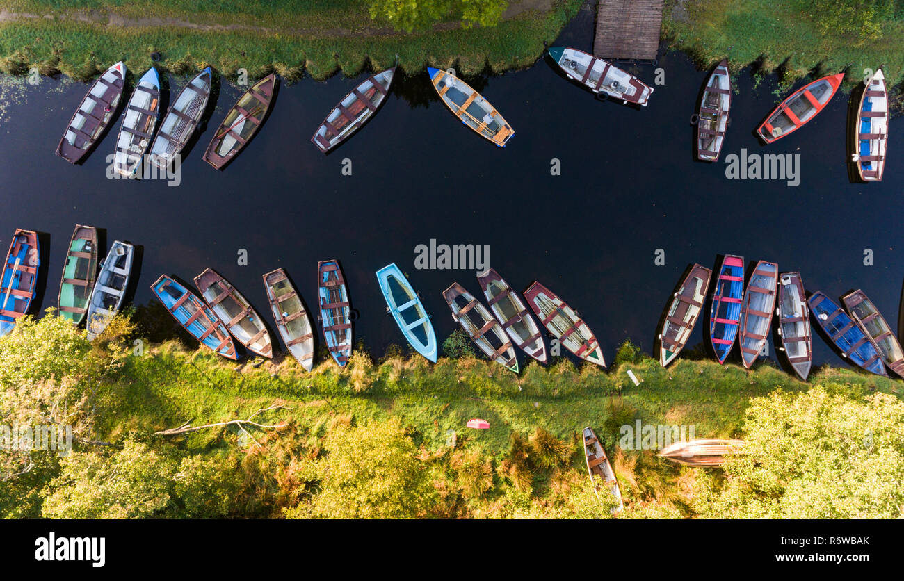 aerial view of small fishing boats in a row on a river canal, Killarney ...
