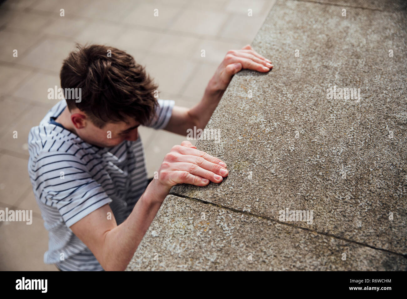 Holding gripping ledge hi-res stock photography and images - Alamy