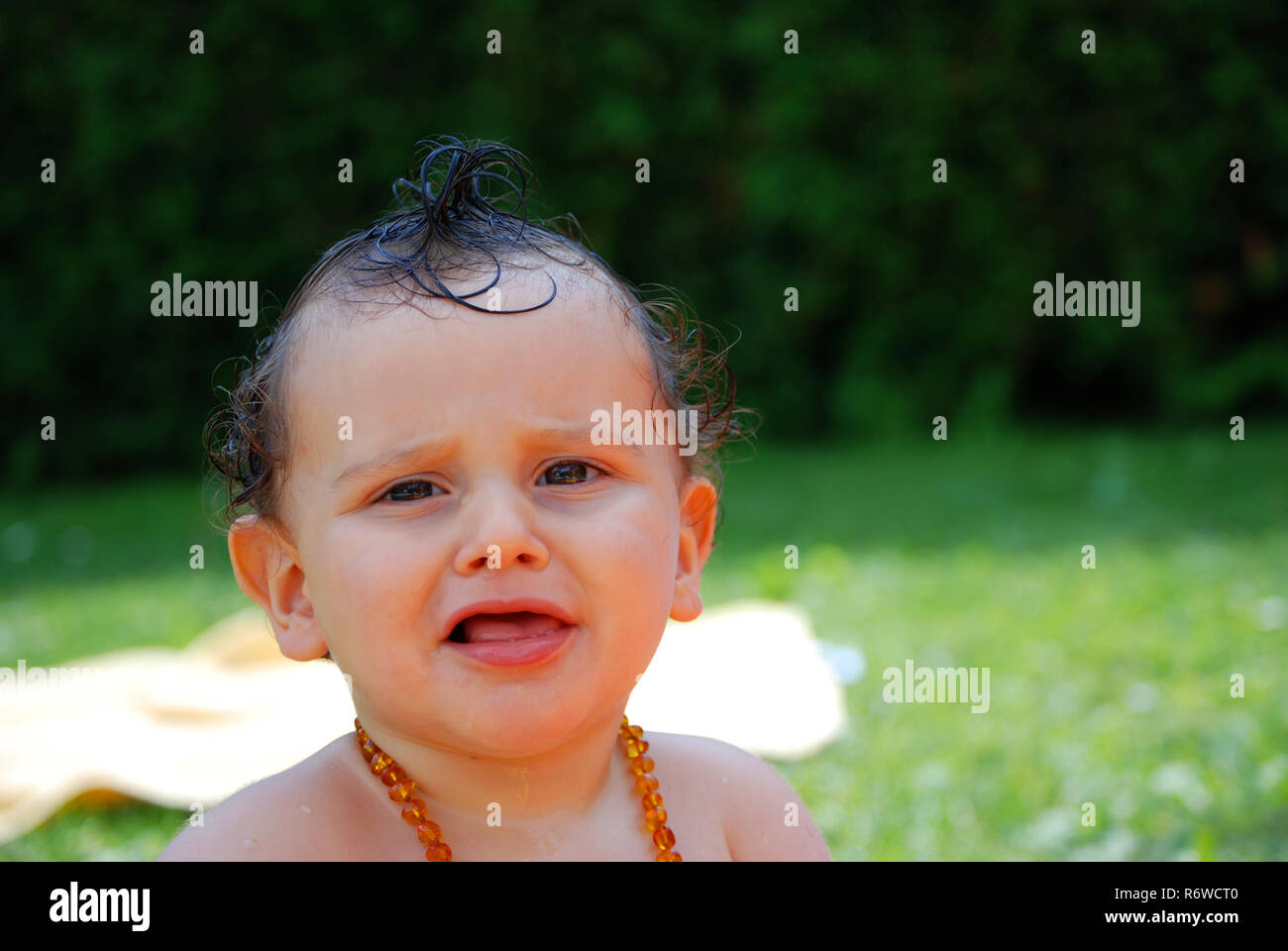 portrait of a baby with skeptical look Stock Photo - Alamy