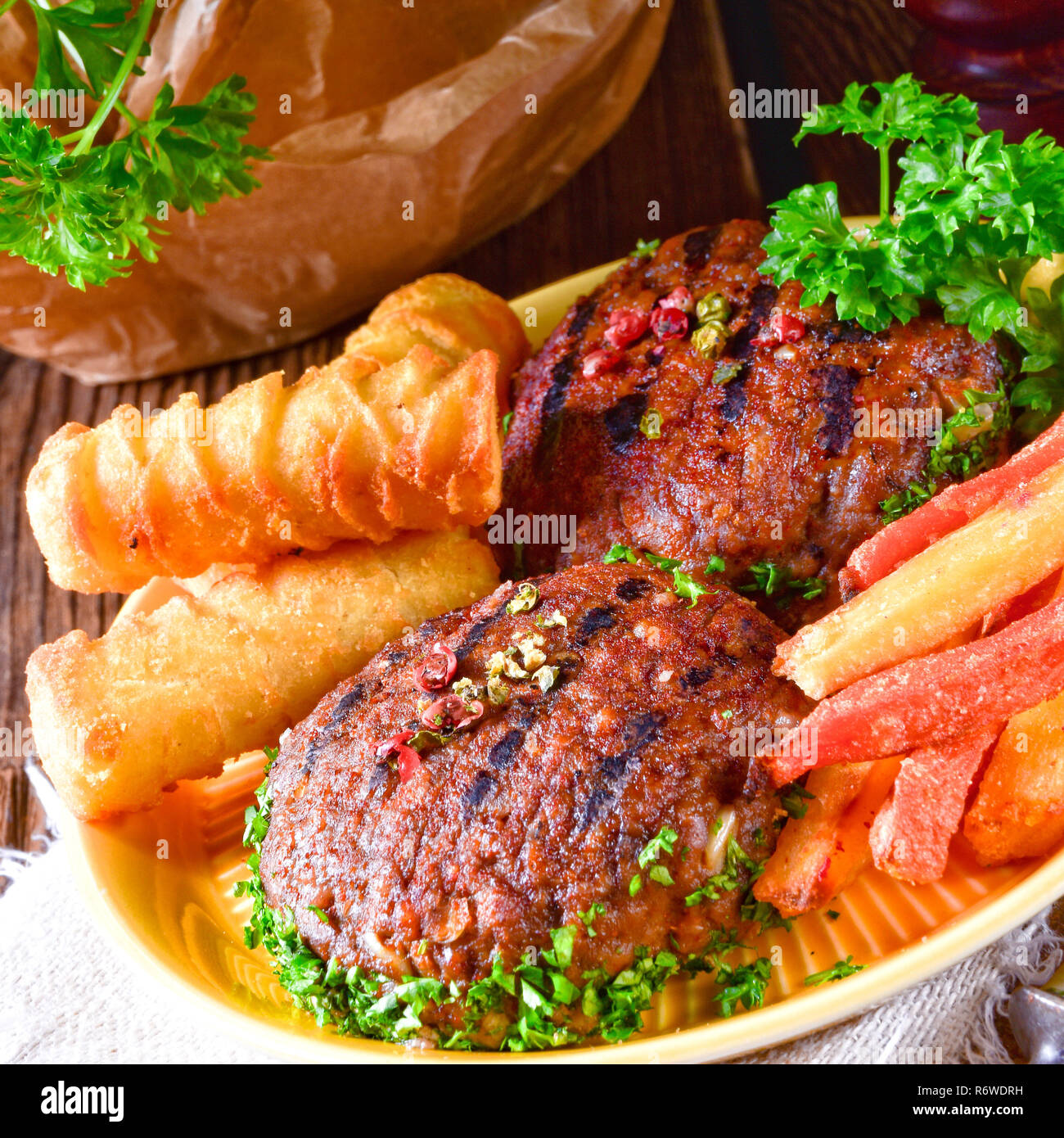grilled bullets with croquettes and vegetables Stock Photo - Alamy