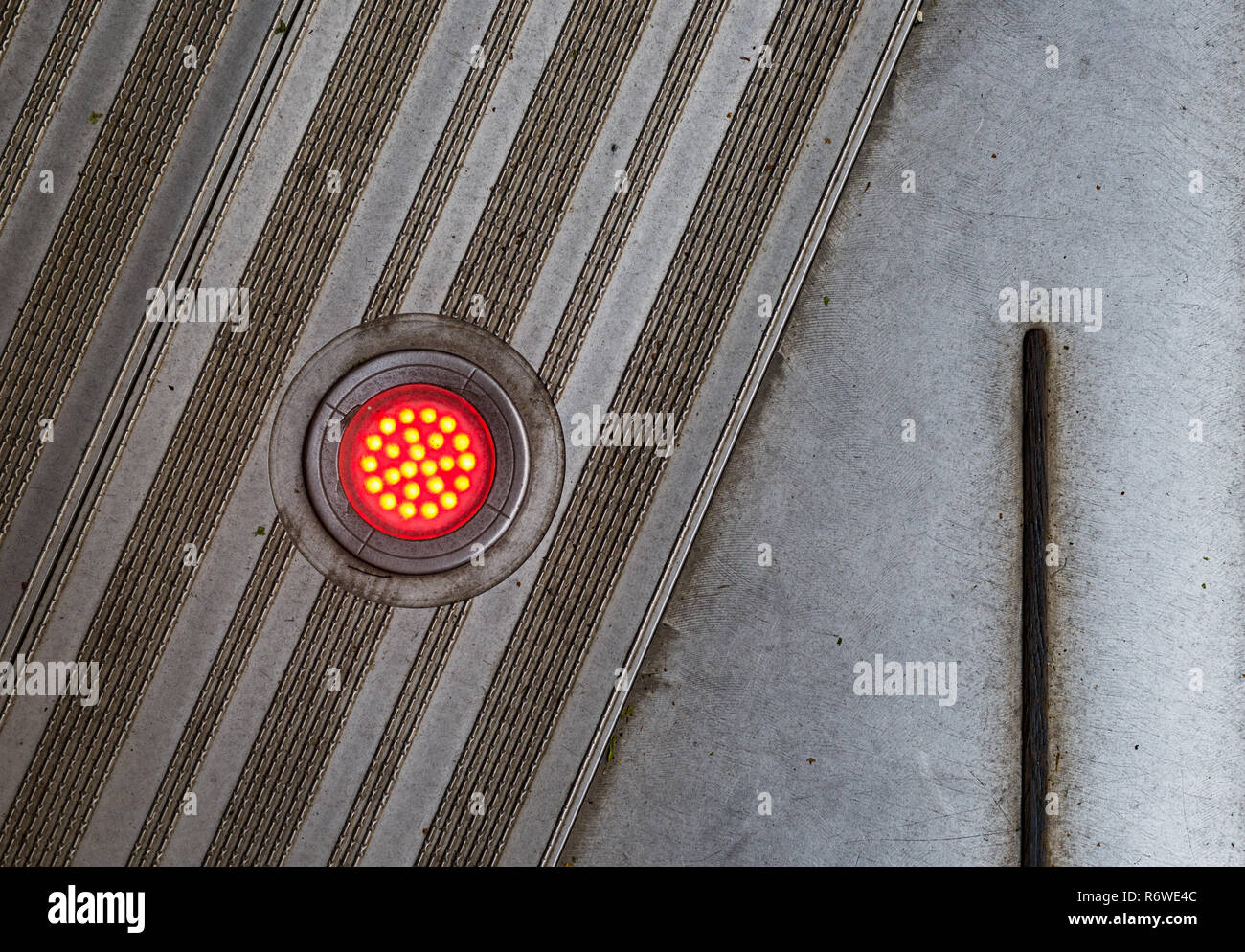 Red LED lights built in to steel floor background Stock Photo - Alamy