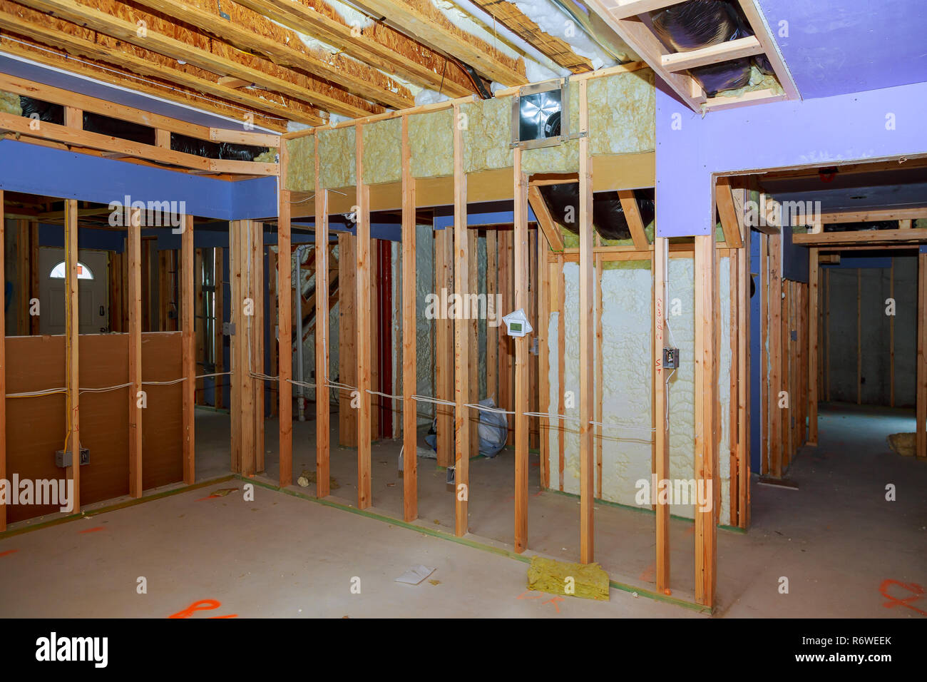 Wood frame of house under beam construction Stock Photo - Alamy