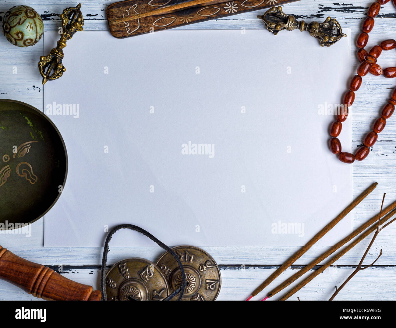 Copper singing bowl, prayer beads, prayer drum, stone balls and other ...